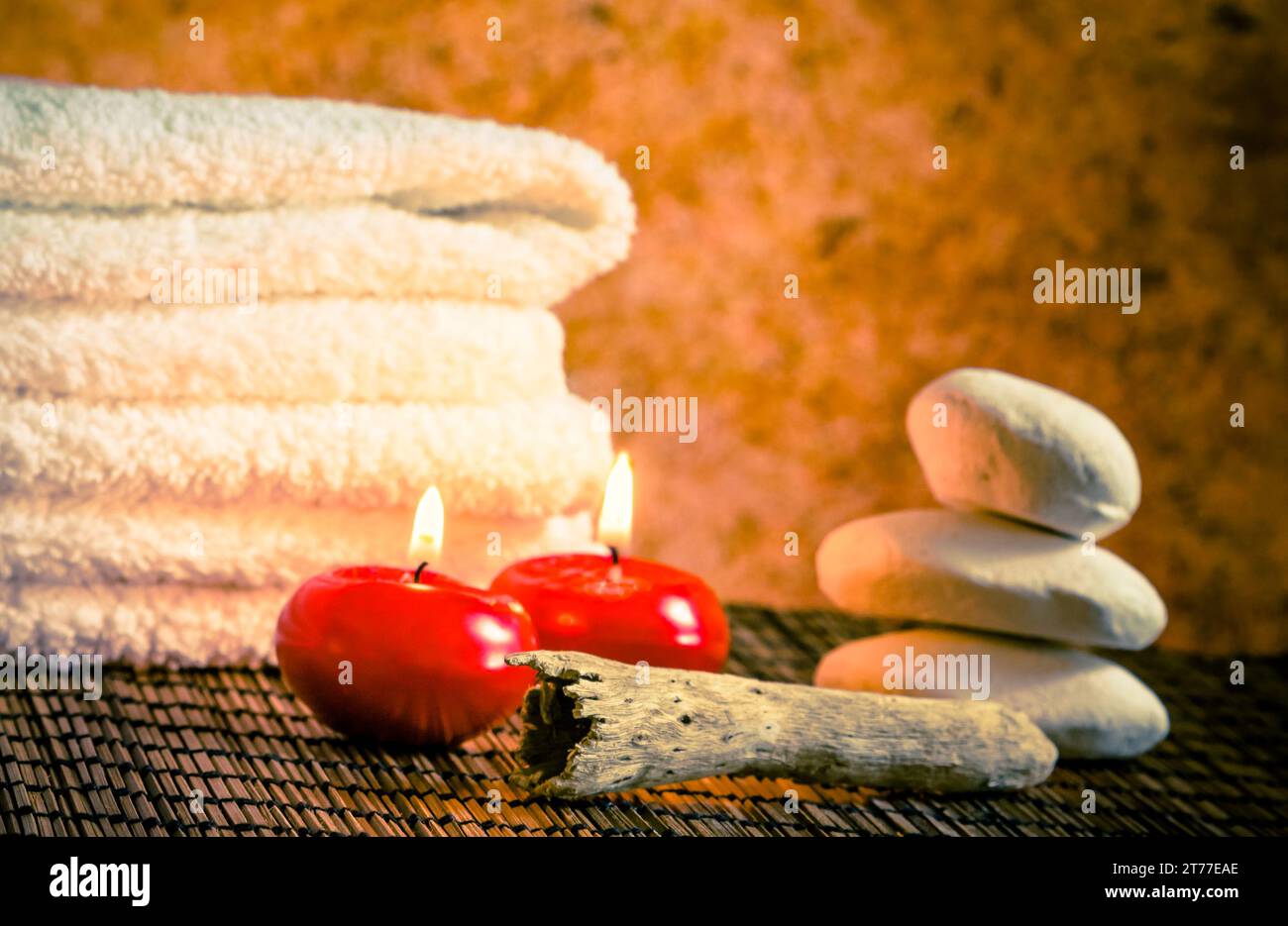 Spa massage border background with towel stacked stone and red candles ...