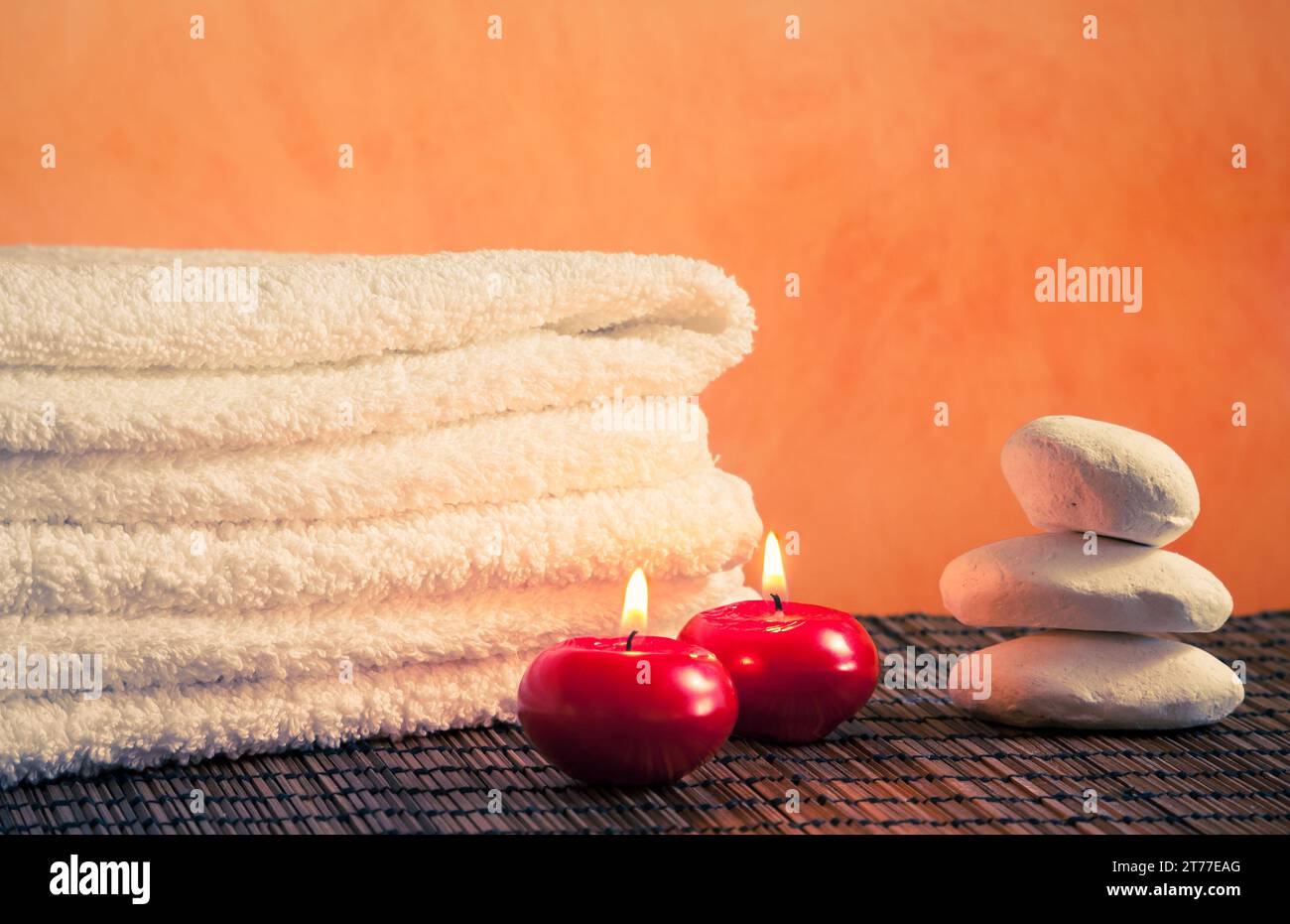 Spa massage border background with towel stacked stone and red candles ...