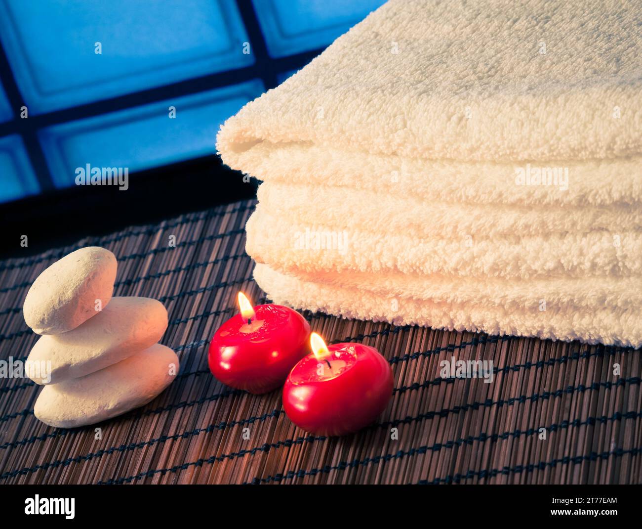 Spa massage border background with towel stacked stone and red candles ...