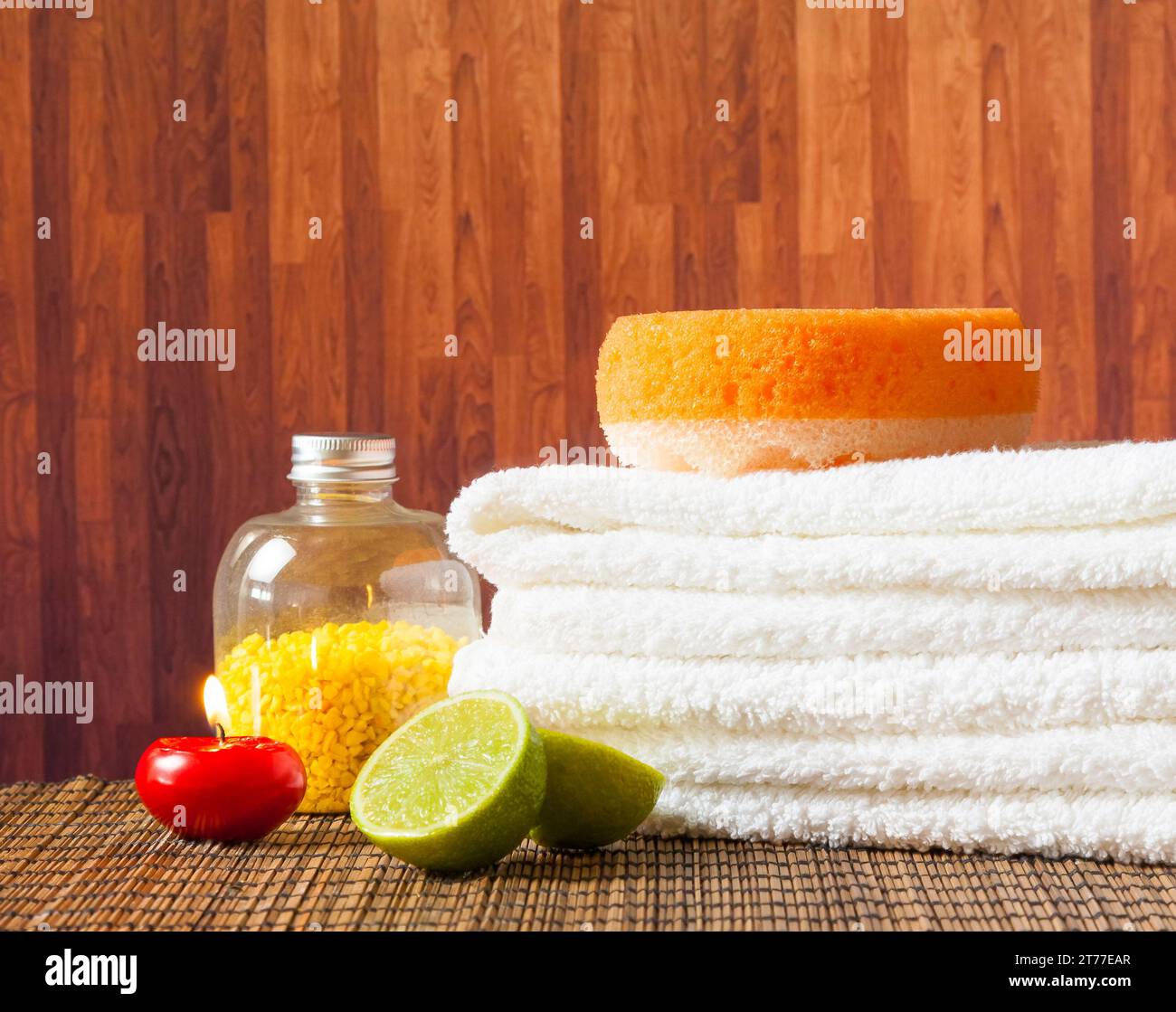 Spa massage border background with towel stacked red candle and lime on ...