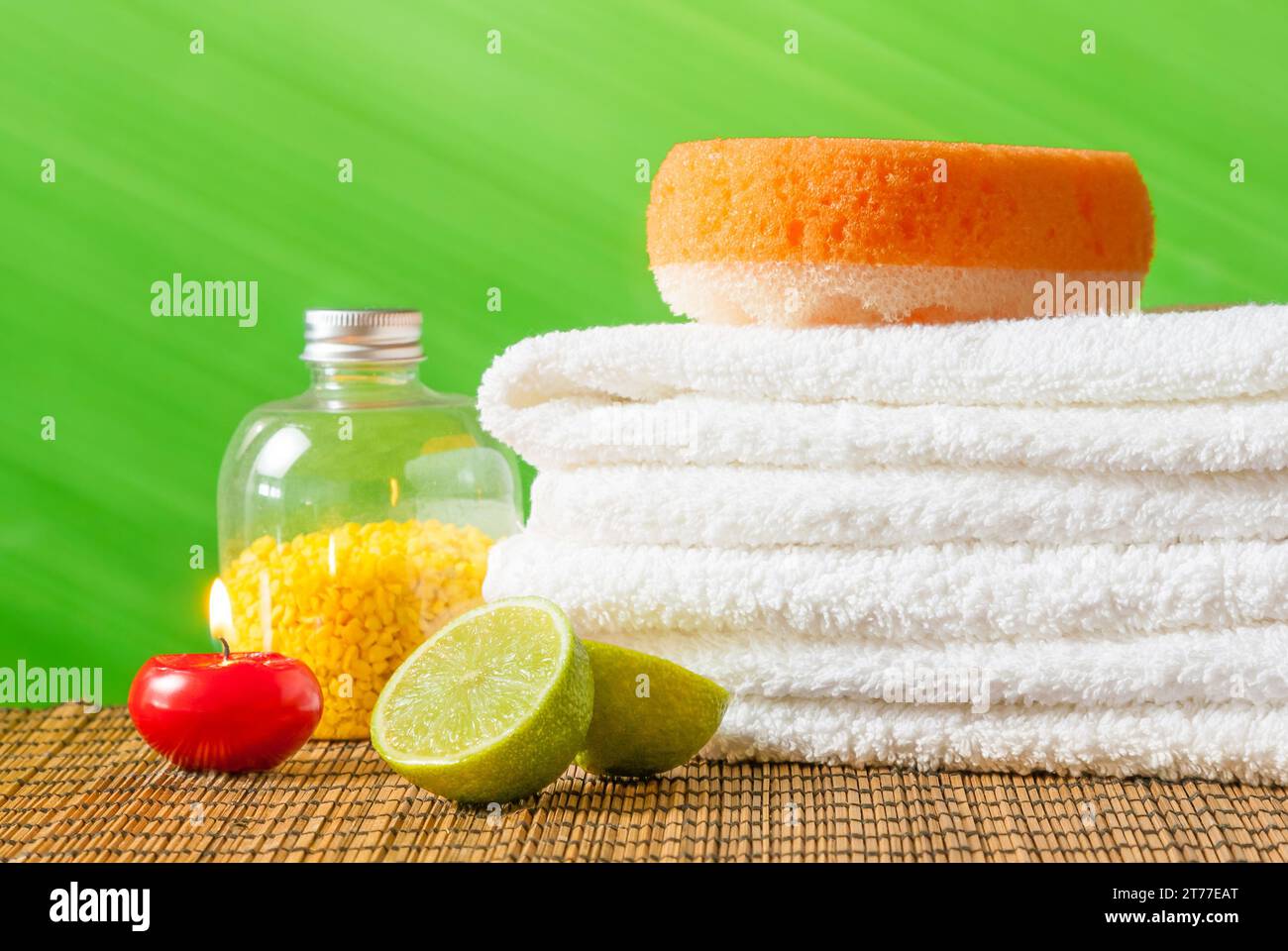 Spa massage border background with towel stacked,red candle and lime on ...