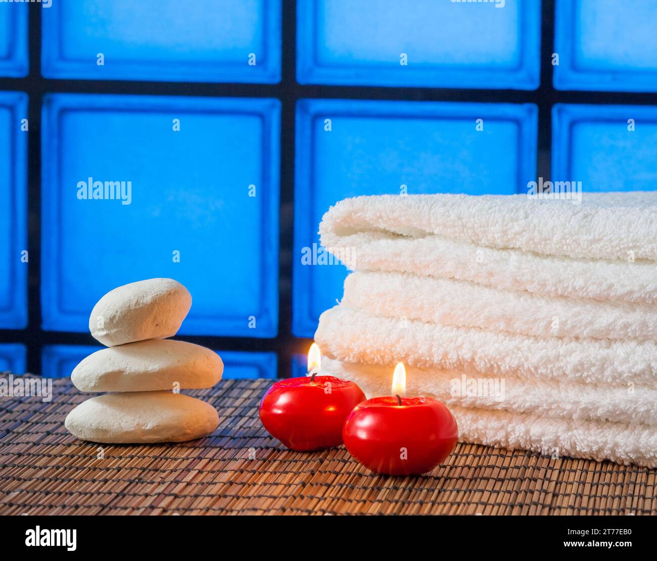 Spa massage border background with towel stacked stone and red candles ...