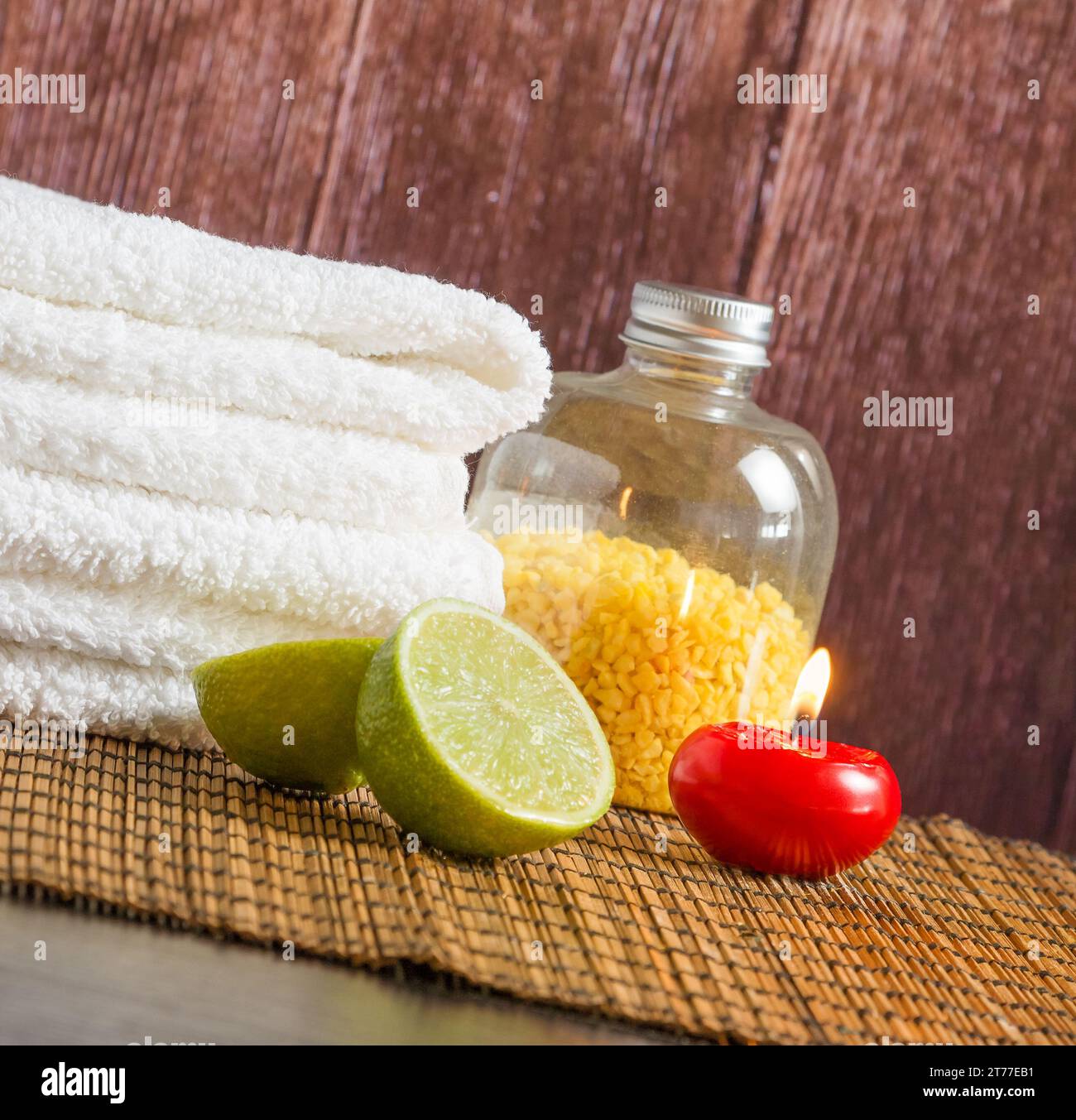 Spa massage border background with towel stacked red candle and lime on ...