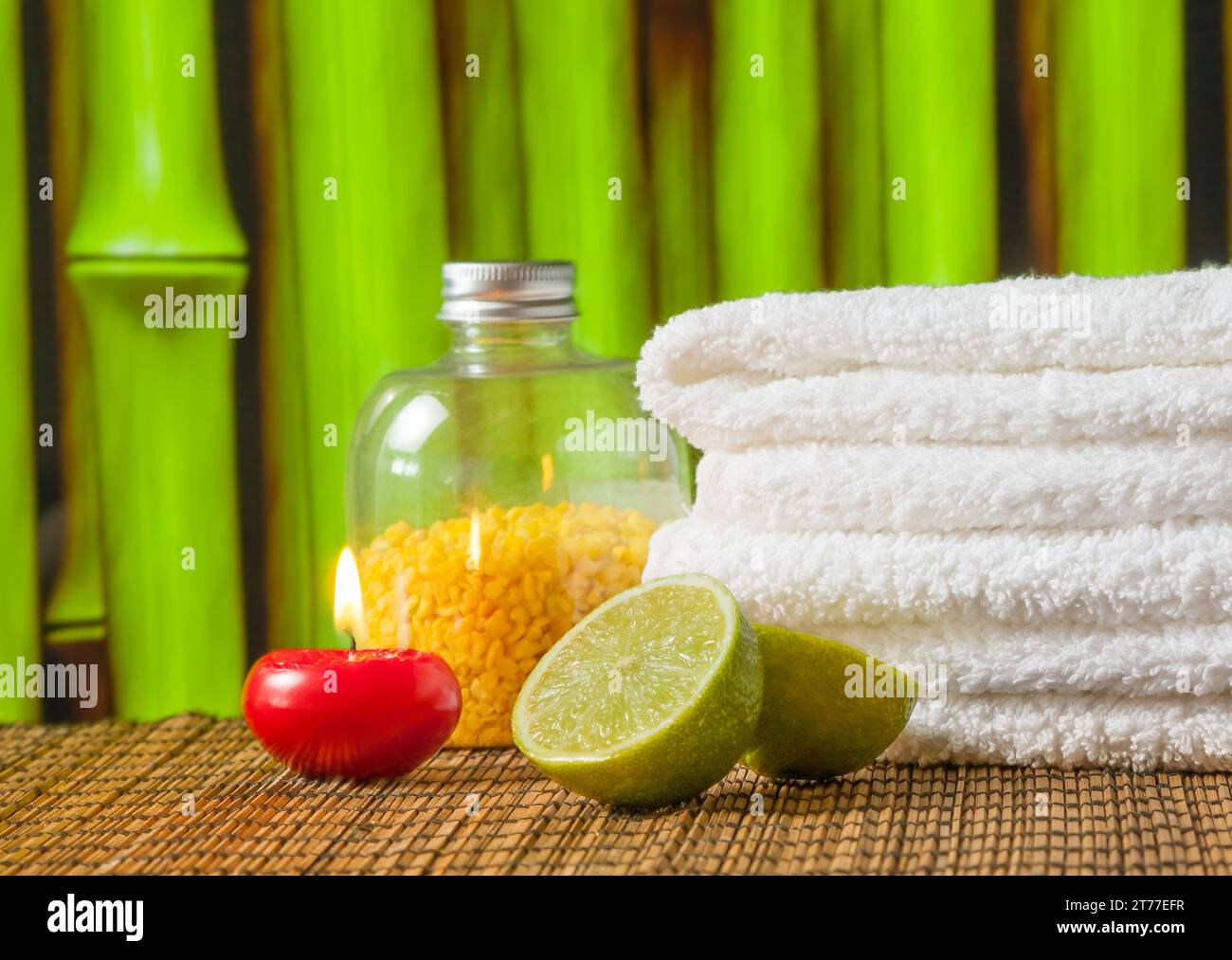 Spa massage border background with towel stacked red candle and lime on ...
