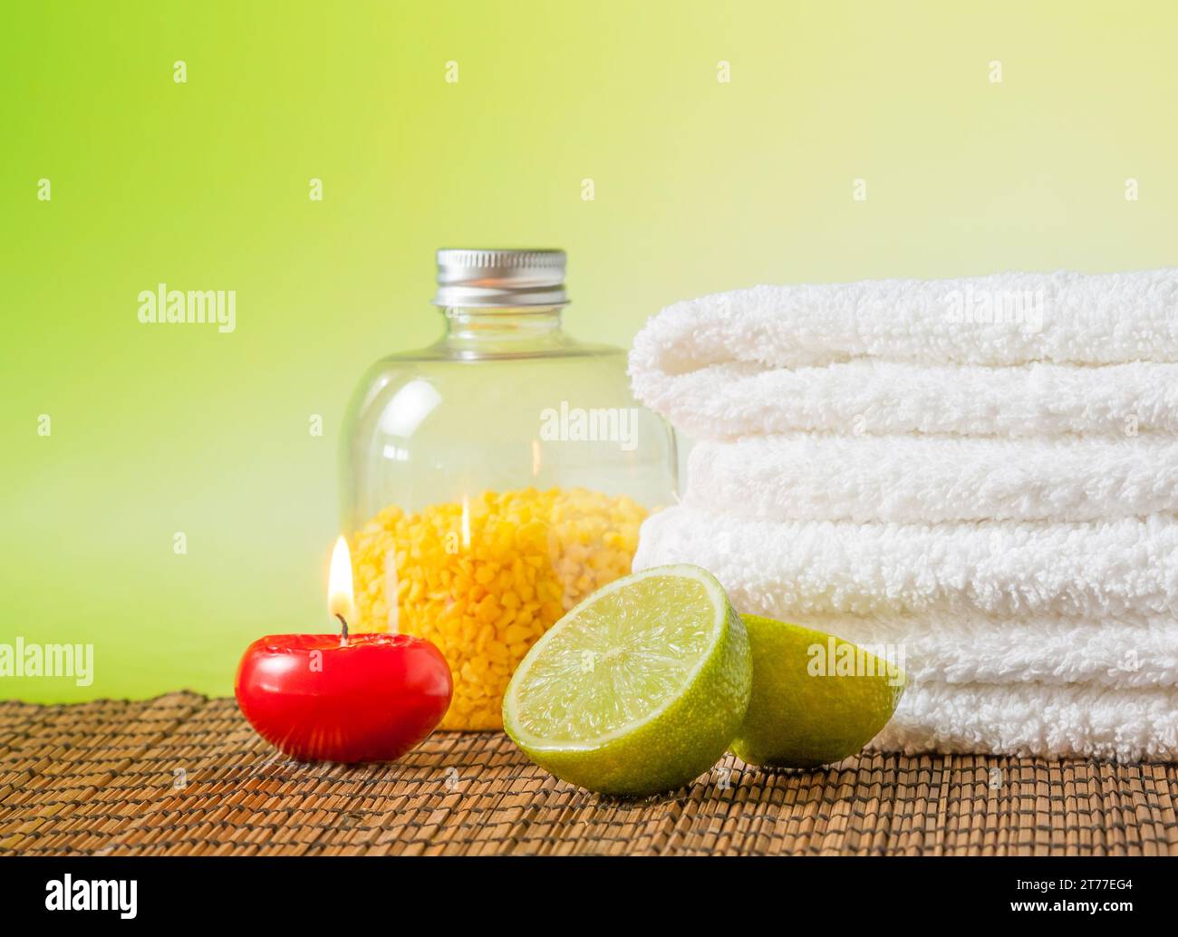 Spa massage border background with towel stacked,red candle and lime on ...