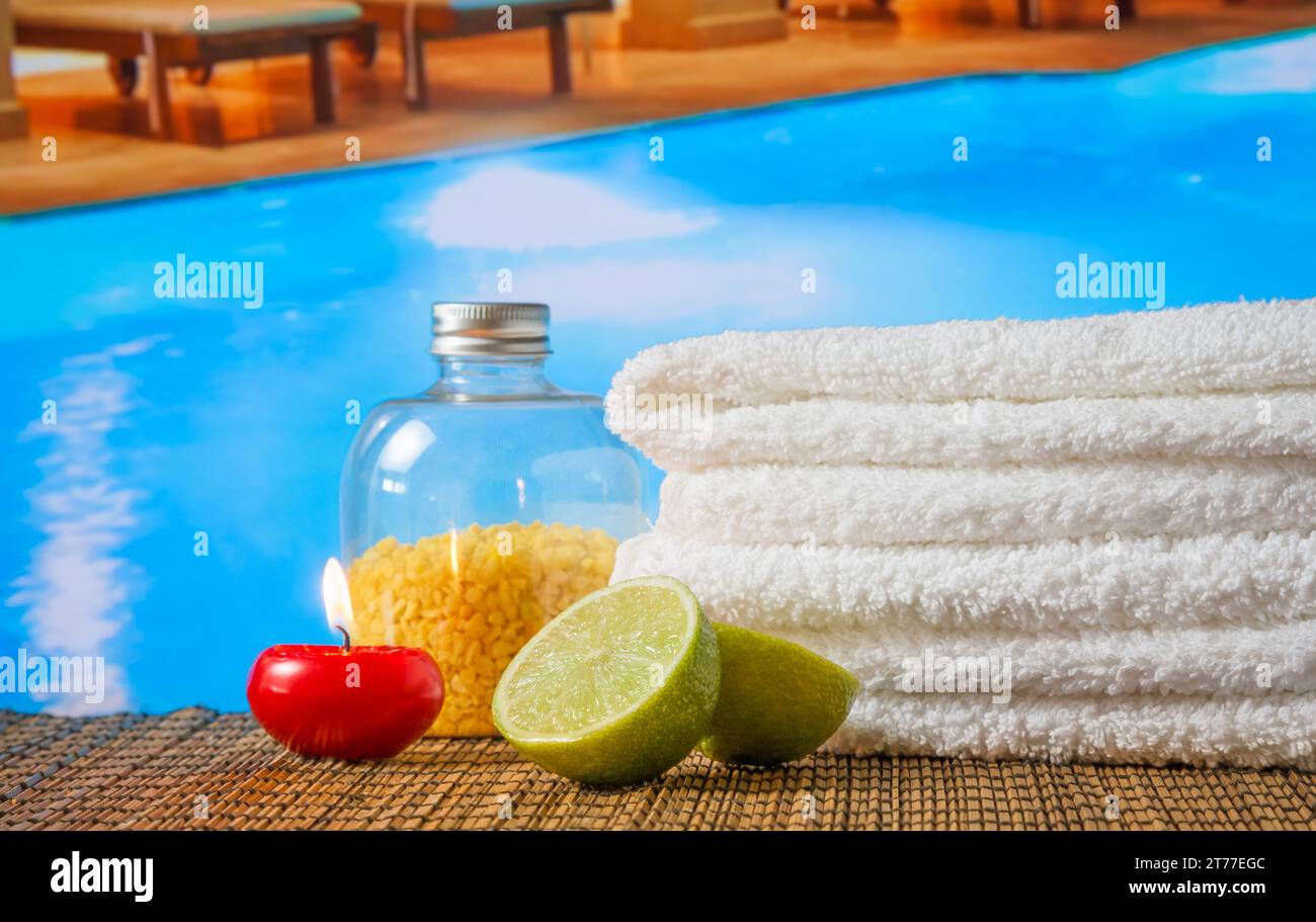 Spa massage border background with towel stacked,red candle and lime on ...