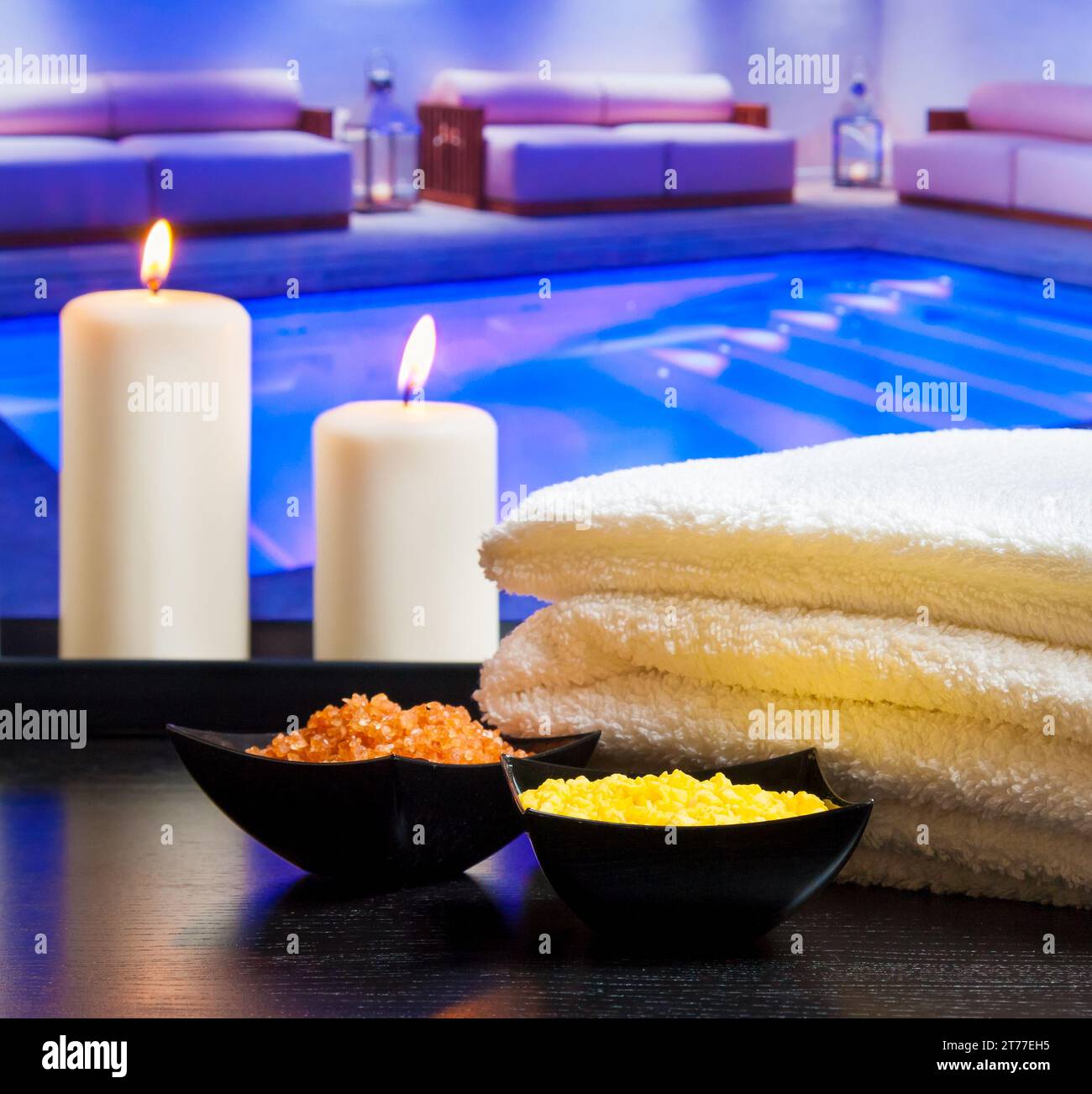 Spa massage border background with towel stacked candles and sea salt ...