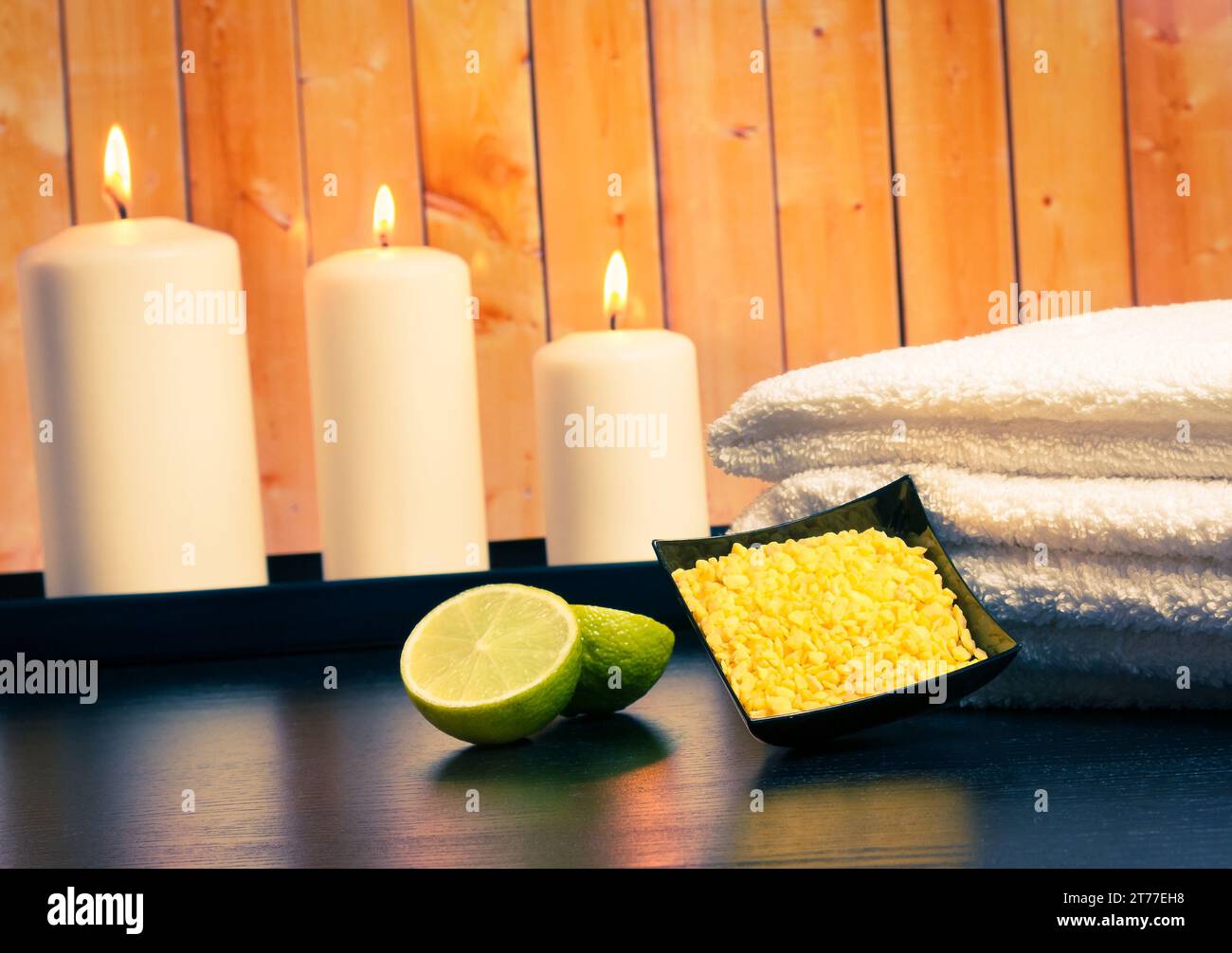 Spa massage border background with towel stacked candles and sea salt ...
