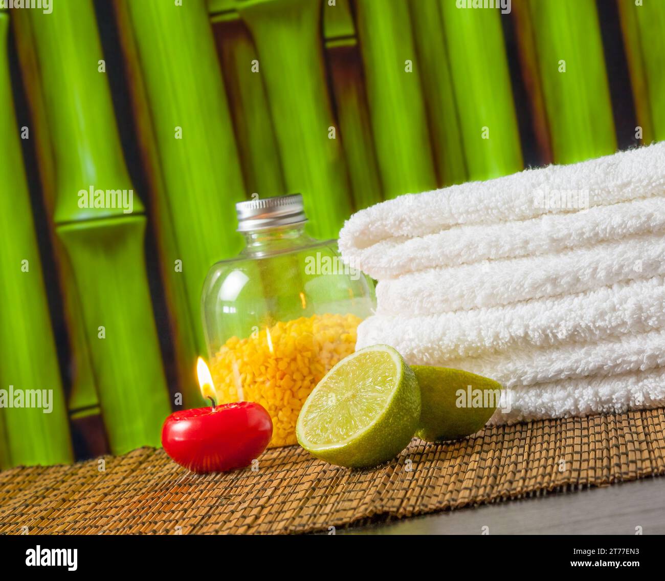 Spa massage border background with towel stacked red candle and lime on ...