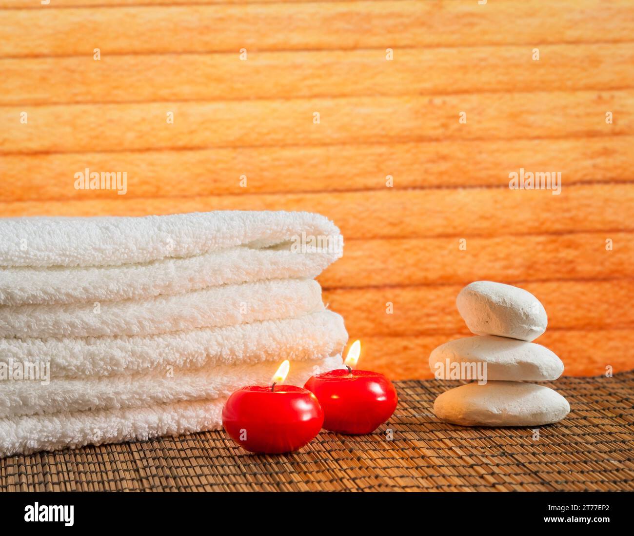 Spa massage border background with towel stacked stone and red candles ...