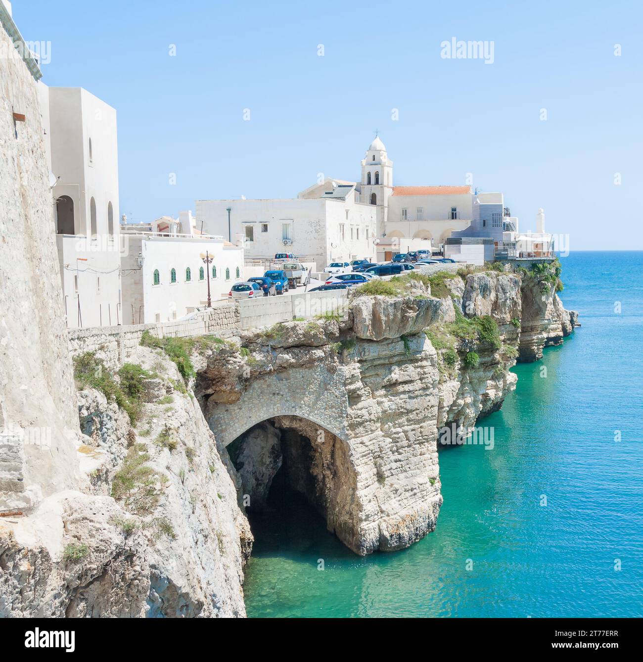 church in front of adriatic sea in the Vieste Italy with cave on sea ...