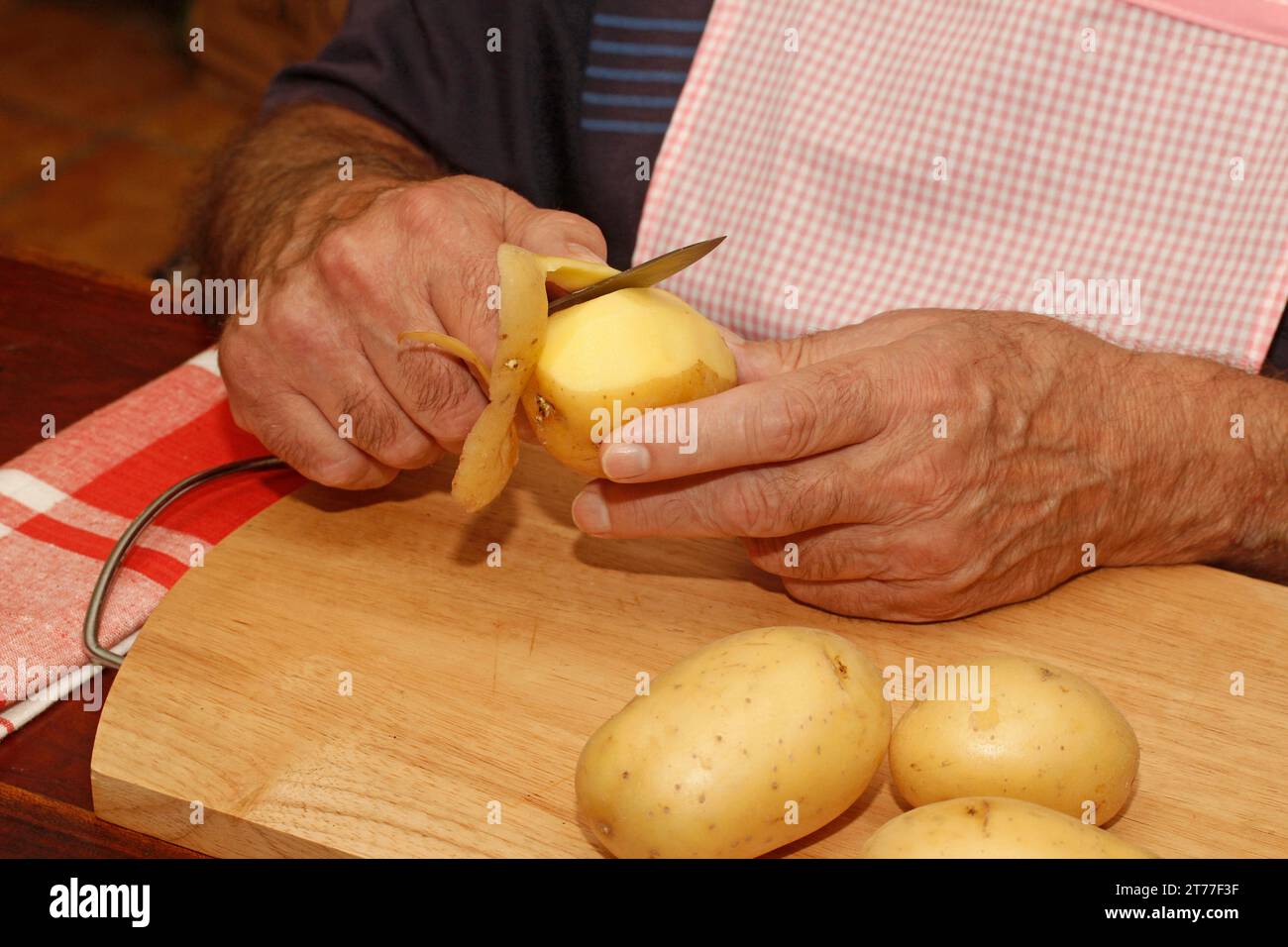 Man peeling potato hi-res stock photography and images - Alamy