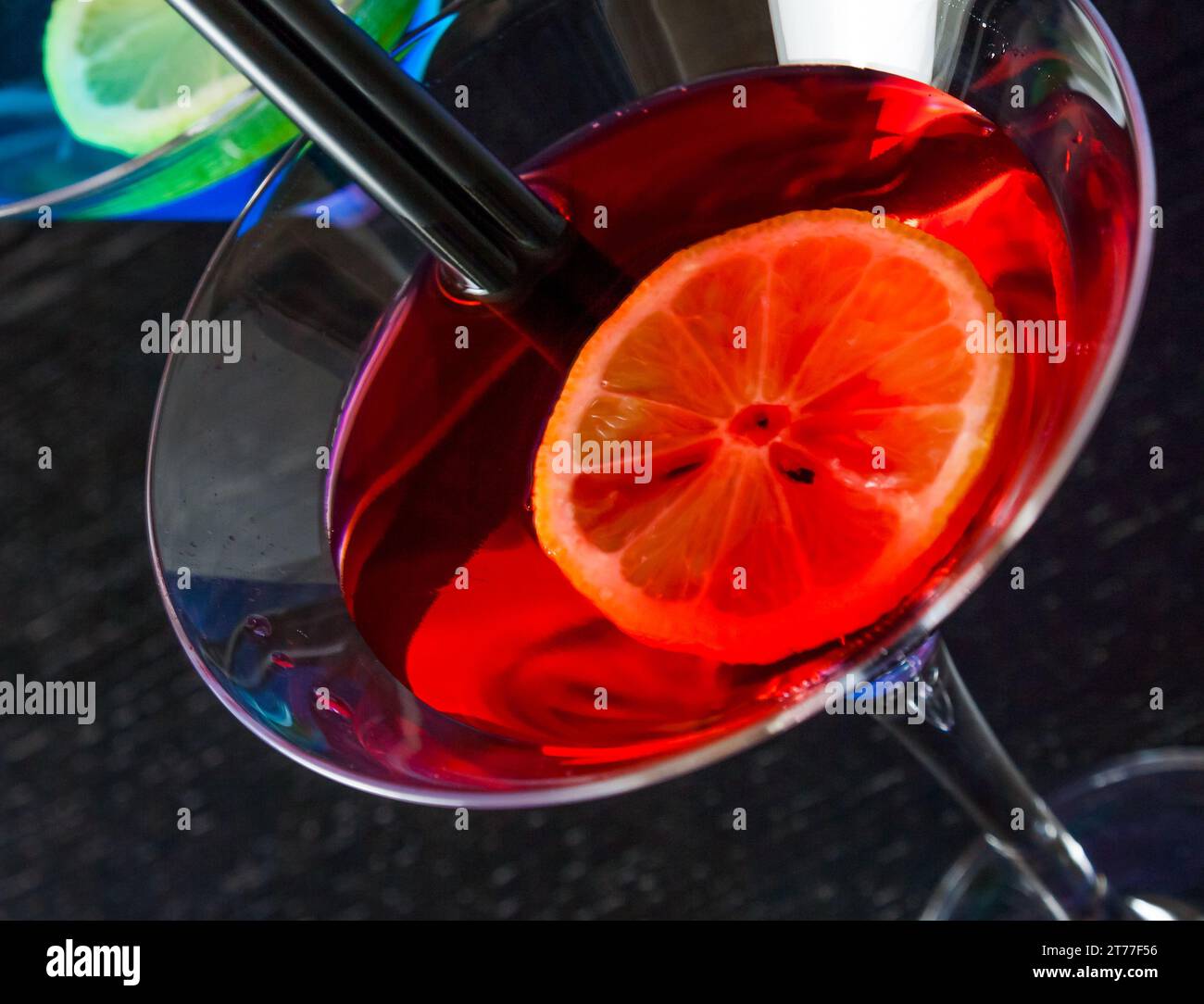 top of view of red cocktail with lemon slice on wood table, dance disco ...