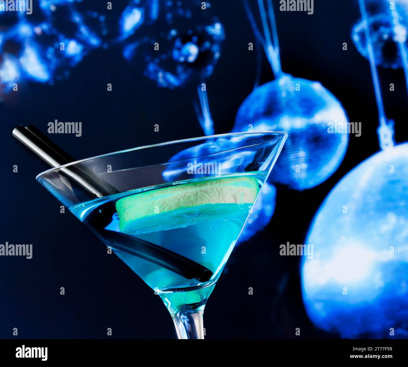 blue cocktail with sparkling disco balls background disco atmosphere ...