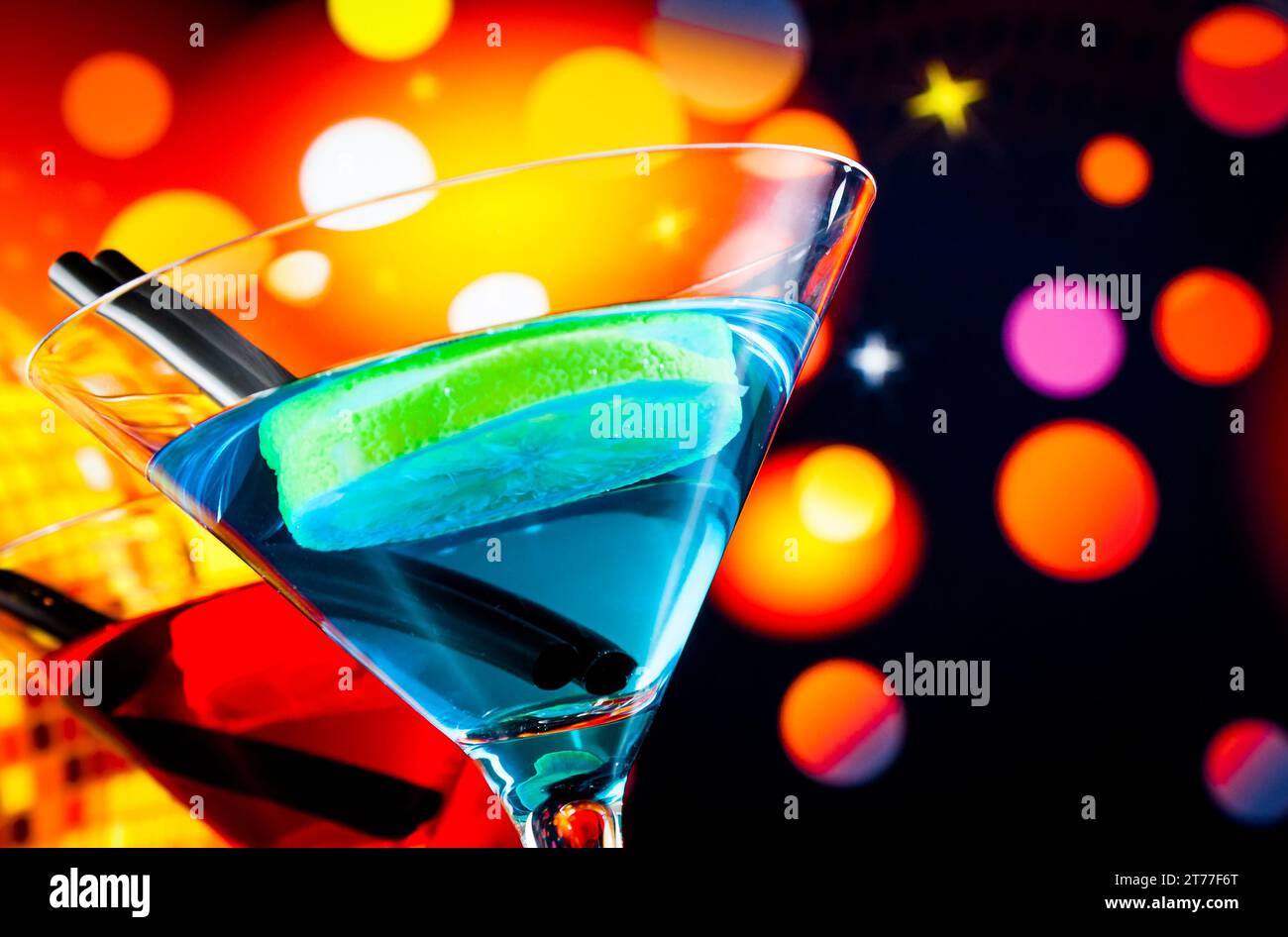 cocktail with light disco bokeh background with space for text, dance ...