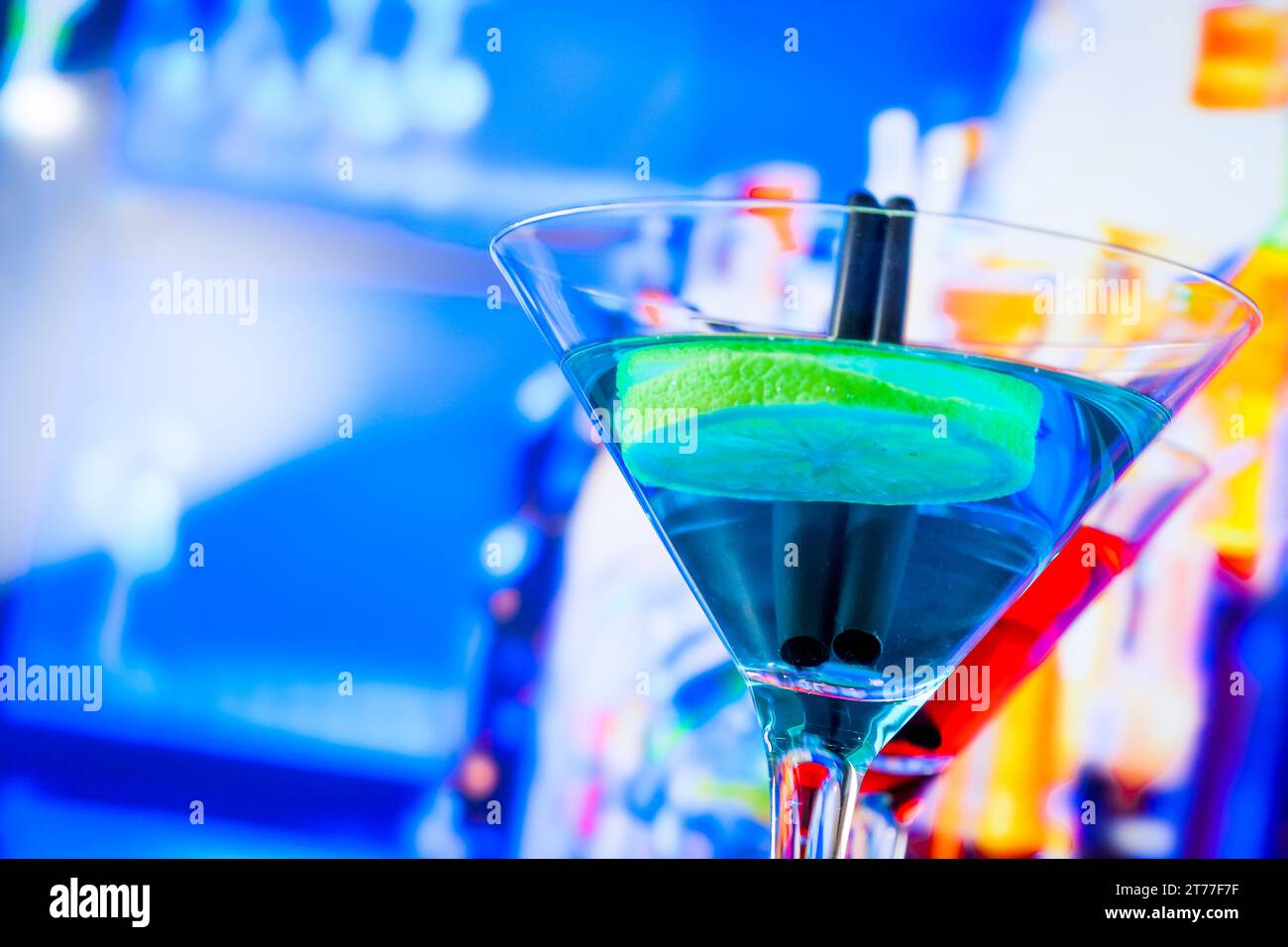 blue and red cocktail with lounge bar background with space for text ...