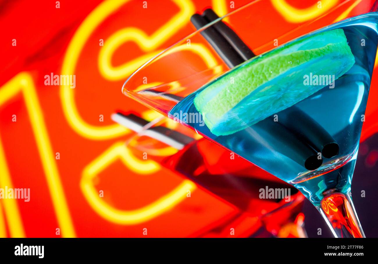 detail of cocktail with neon disco word background with space for text ...