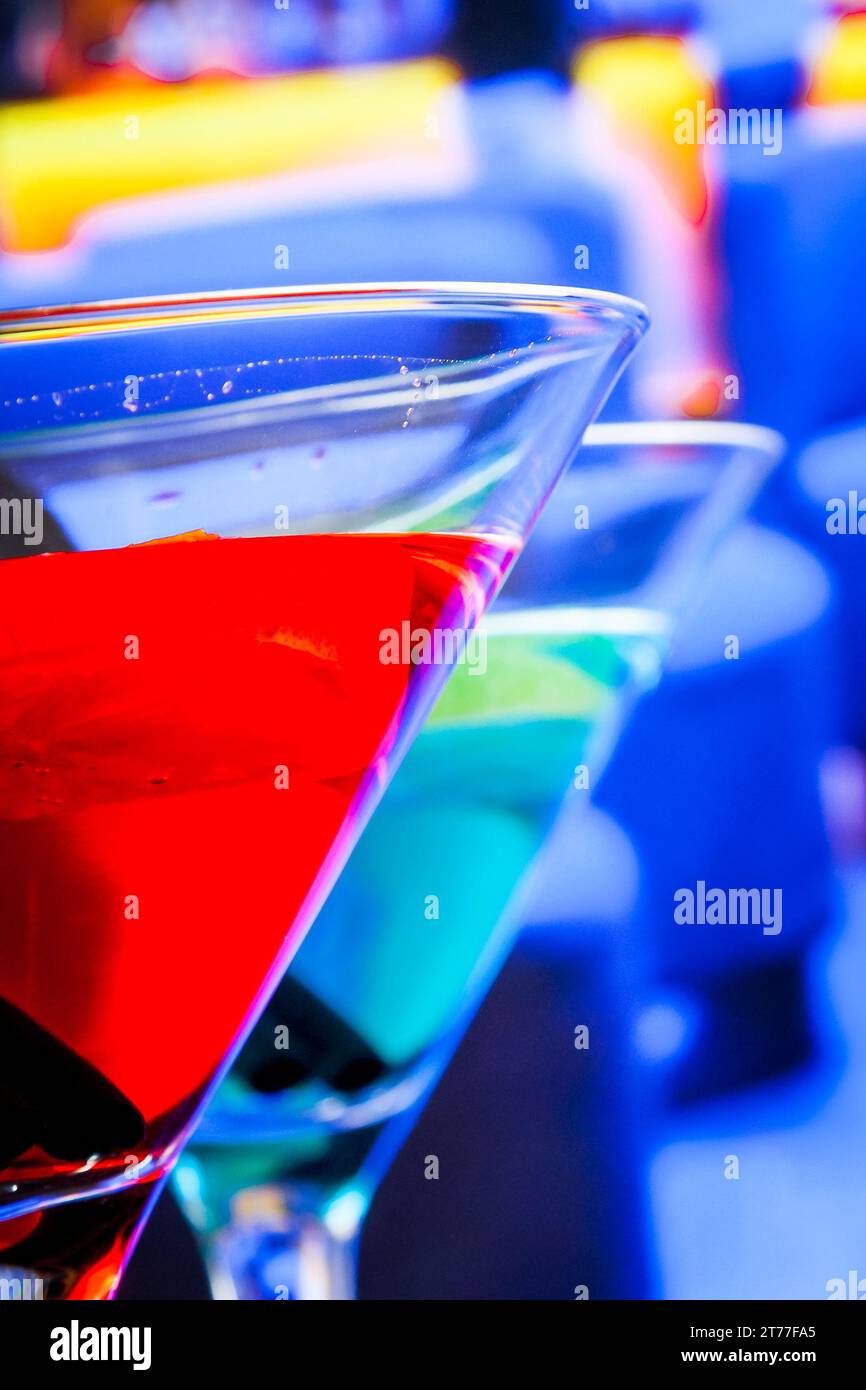 blue and red cocktail drink with space for text, lounge bar background ...