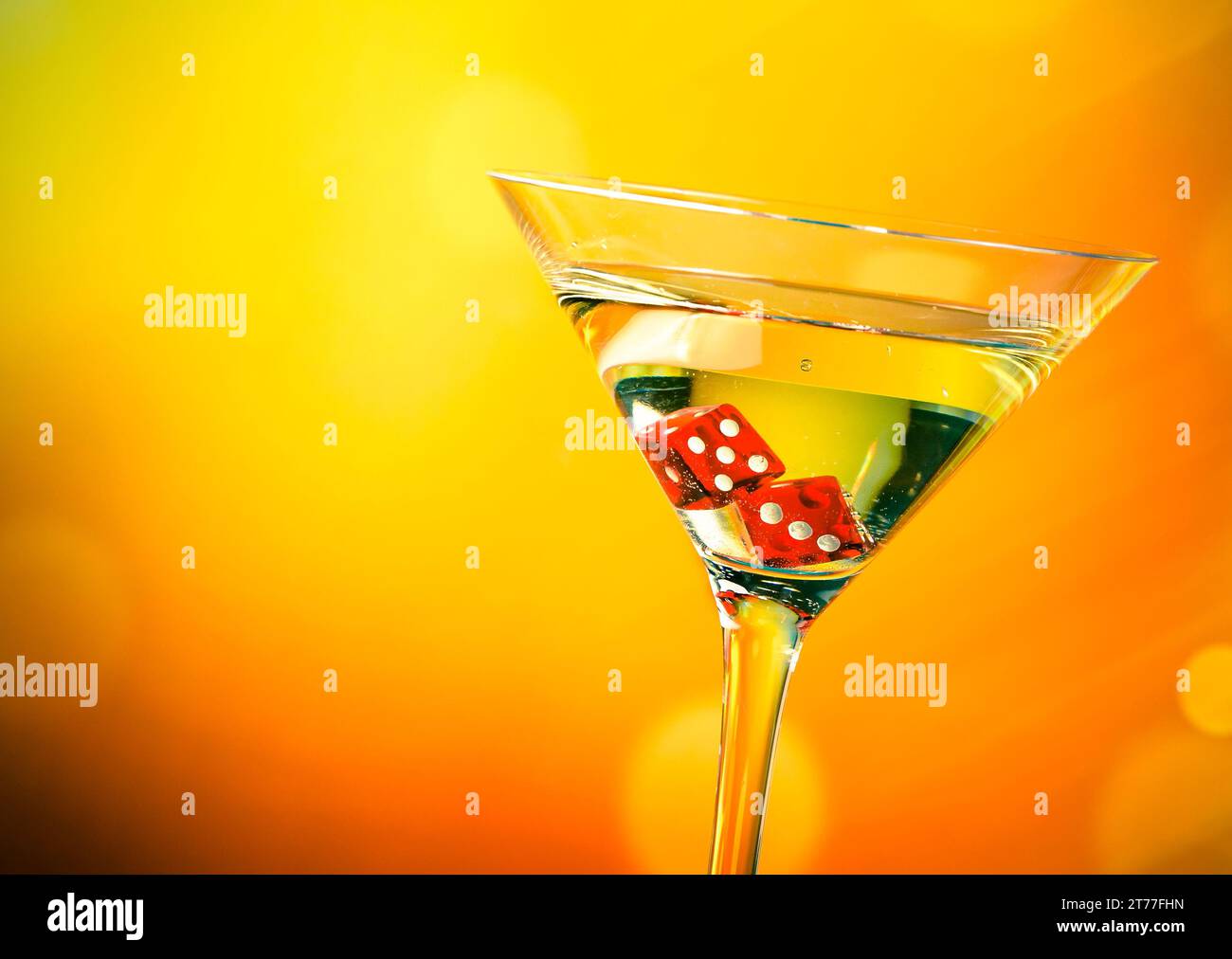 red dice in the cocktail glass on golden bokeh background Stock Photo ...