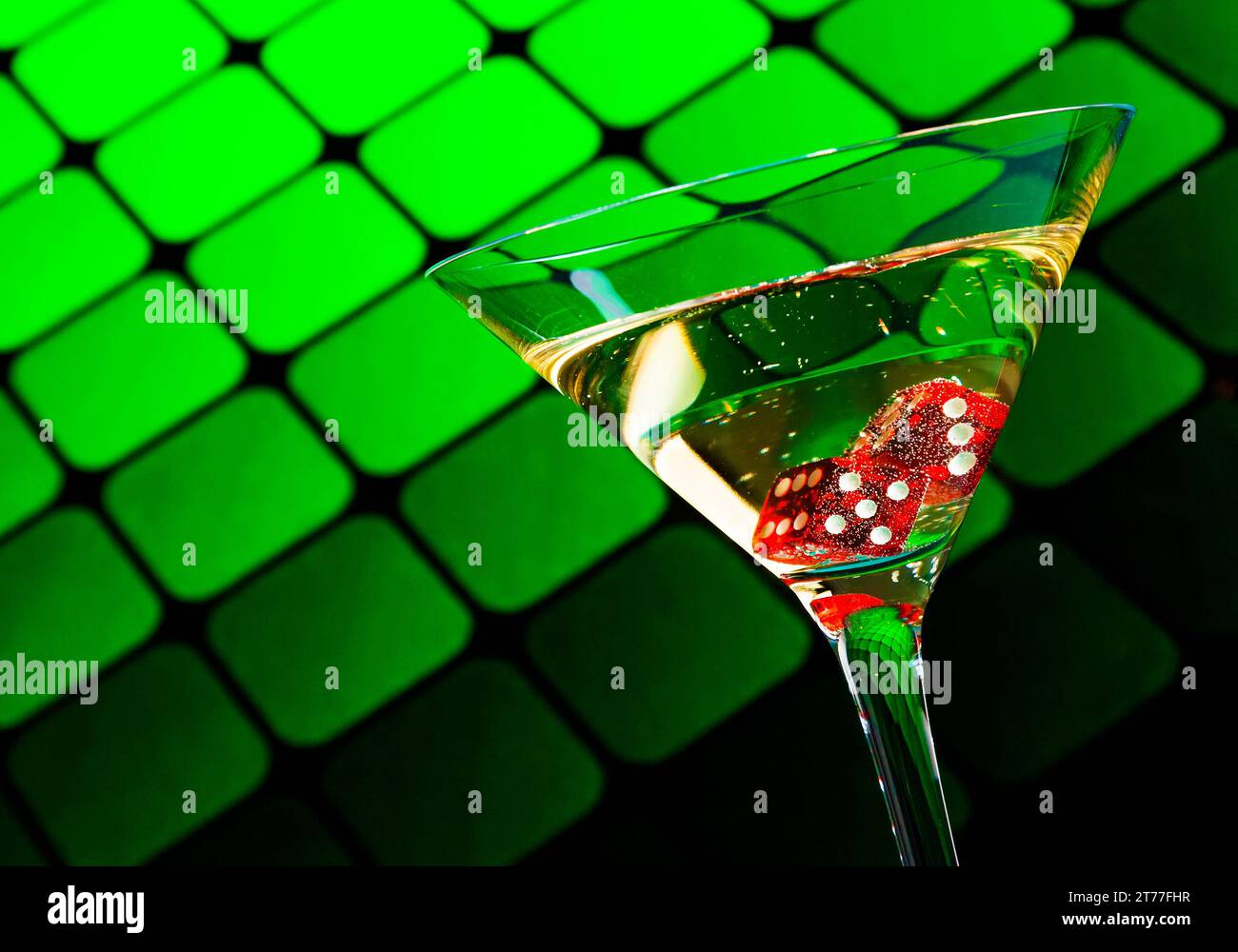 red dice in the cocktail glass on blur green background Stock Photo - Alamy