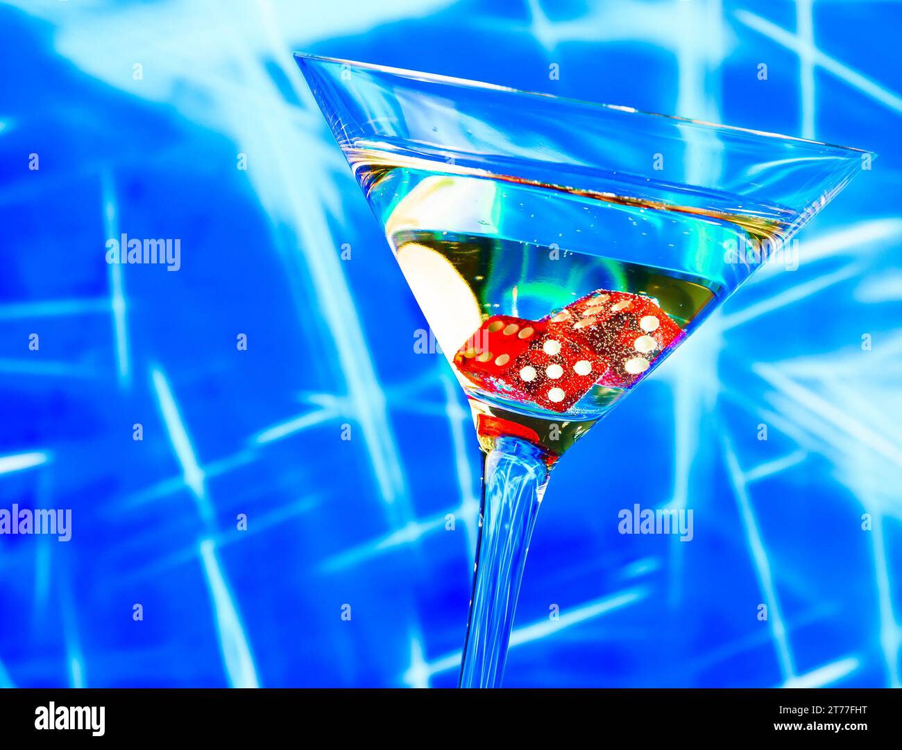 red dice in the cocktail glass on blur blue background Stock Photo - Alamy