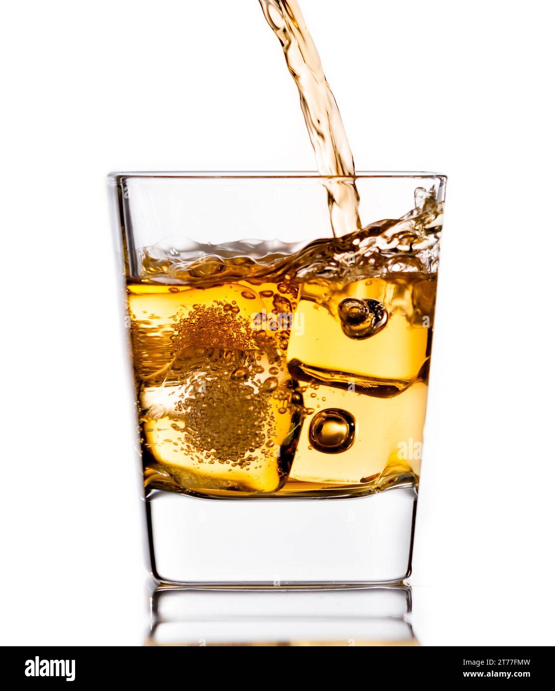 pouring scotch whiskey in glass with ice cubes isolated on white ...