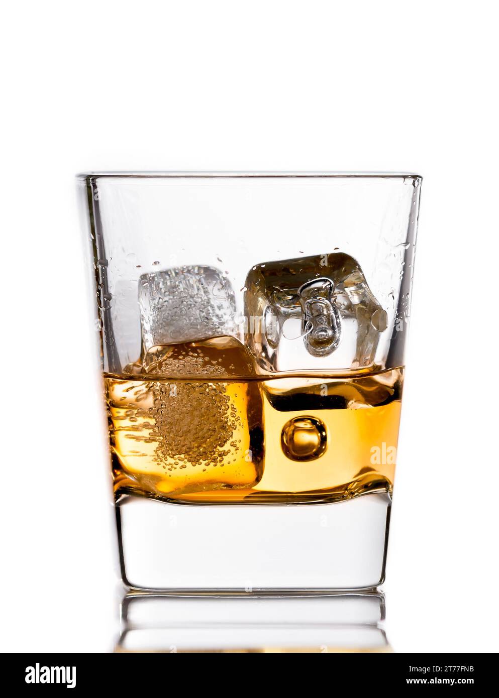 scotch whiskey in glass with ice cubes isolated on white background ...