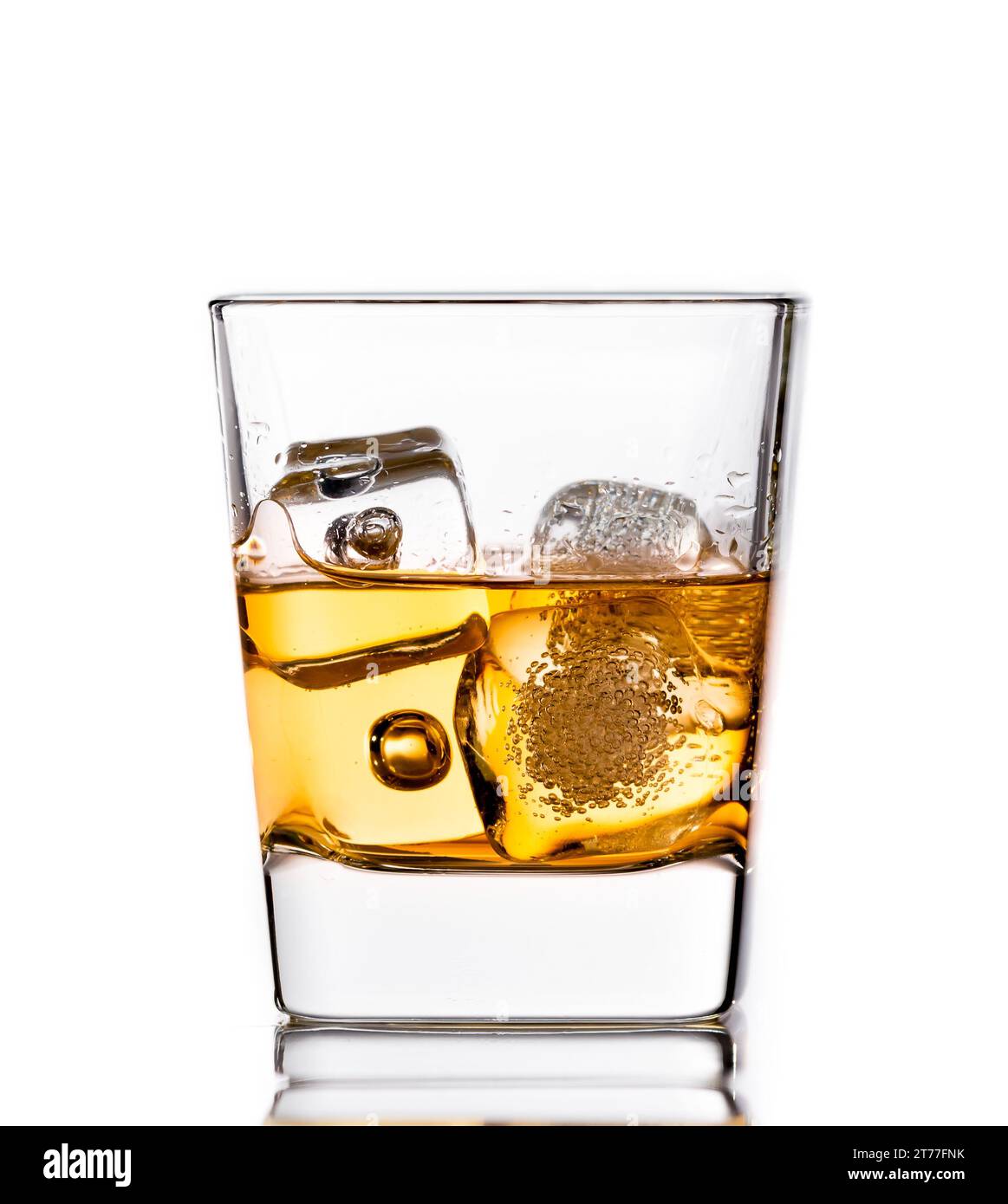 scotch whiskey in glass with ice cubes isolated on white background ...