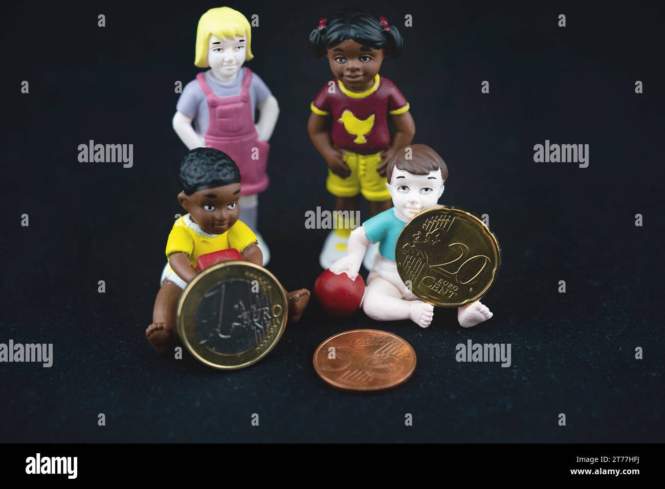 children's plastic figures with euro coins, symbolic image of child ...