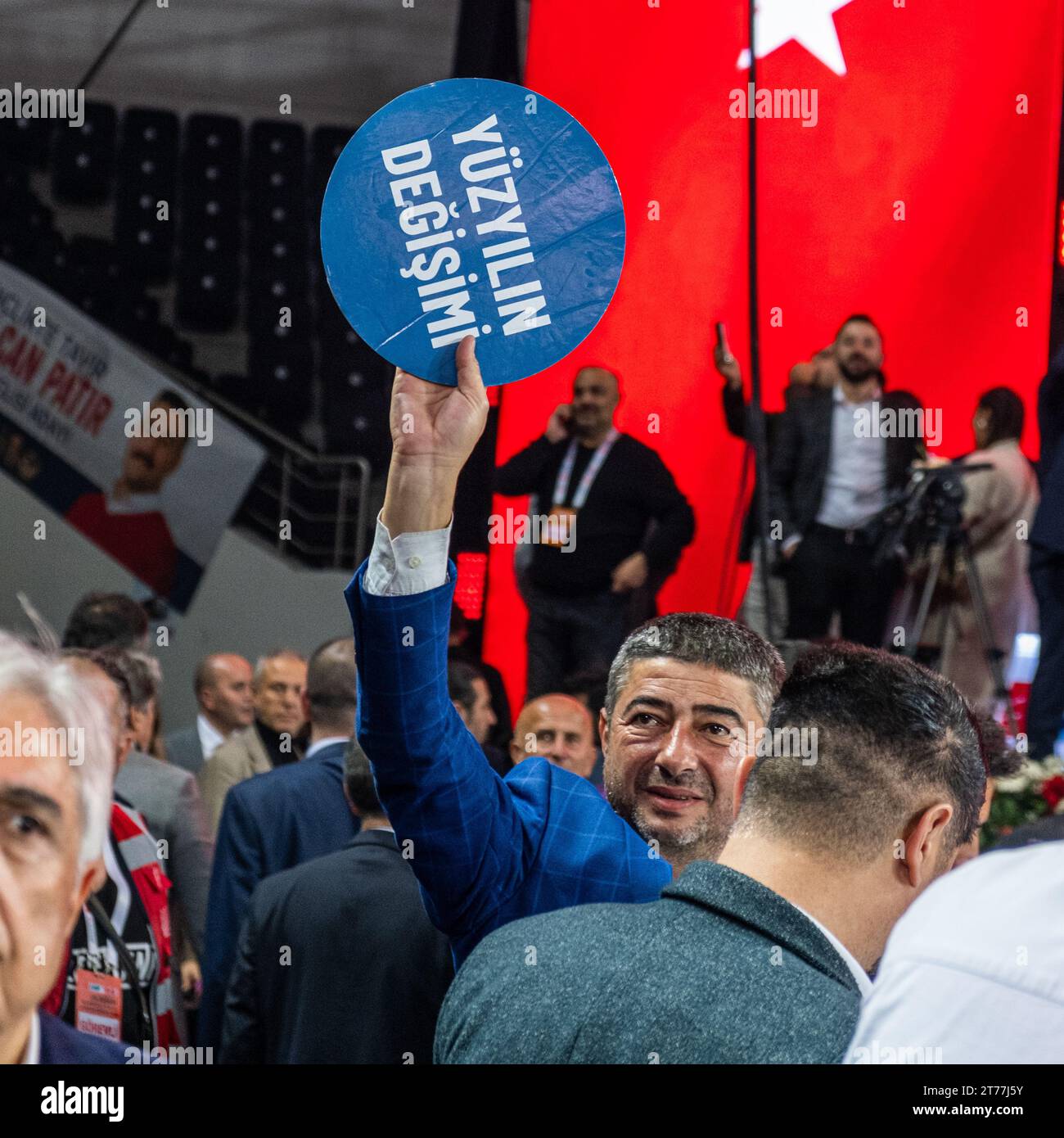 A man holding a banner reading "The change of the century" at the 38th ...