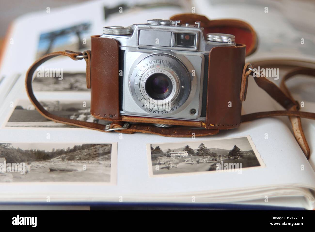 old camera on a picture album Stock Photo - Alamy