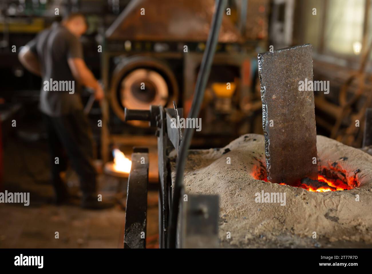 Foundry - ferrous metal is melted in an induction furnace of ...