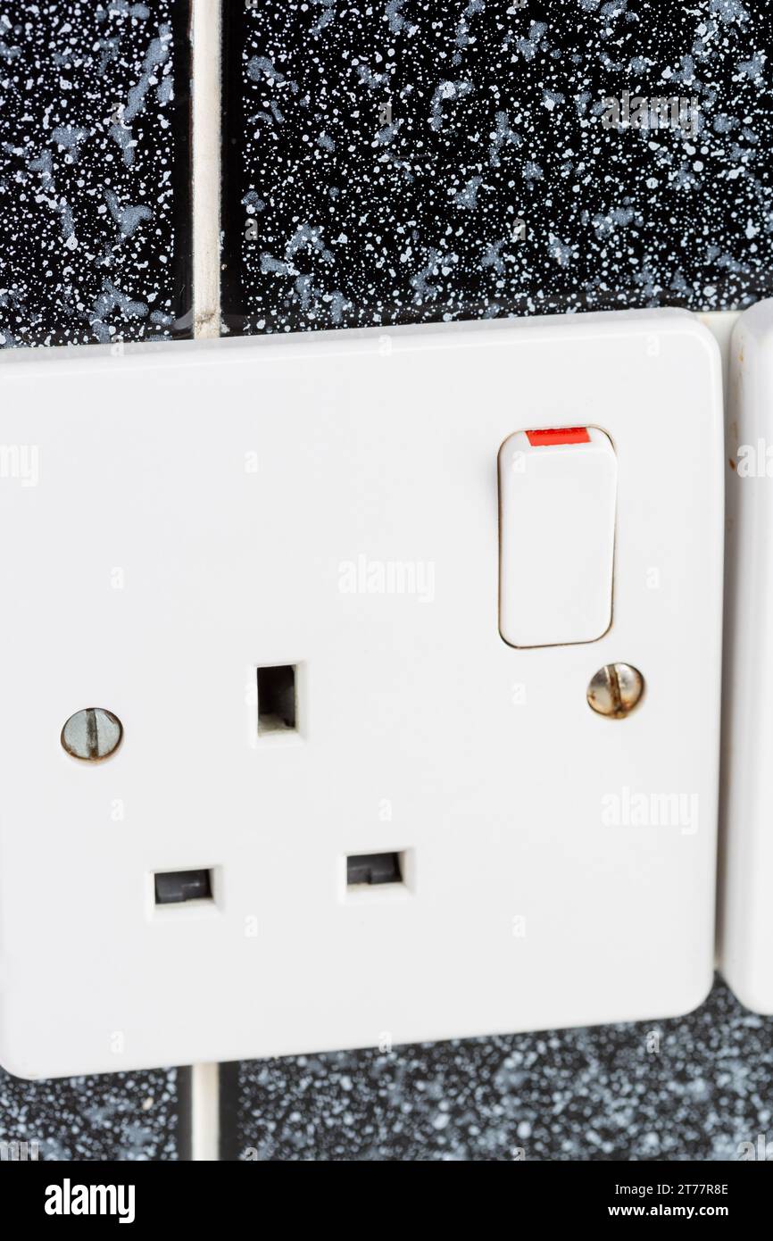 Close up of a toggle switch on a UK plug socket Stock Photo - Alamy