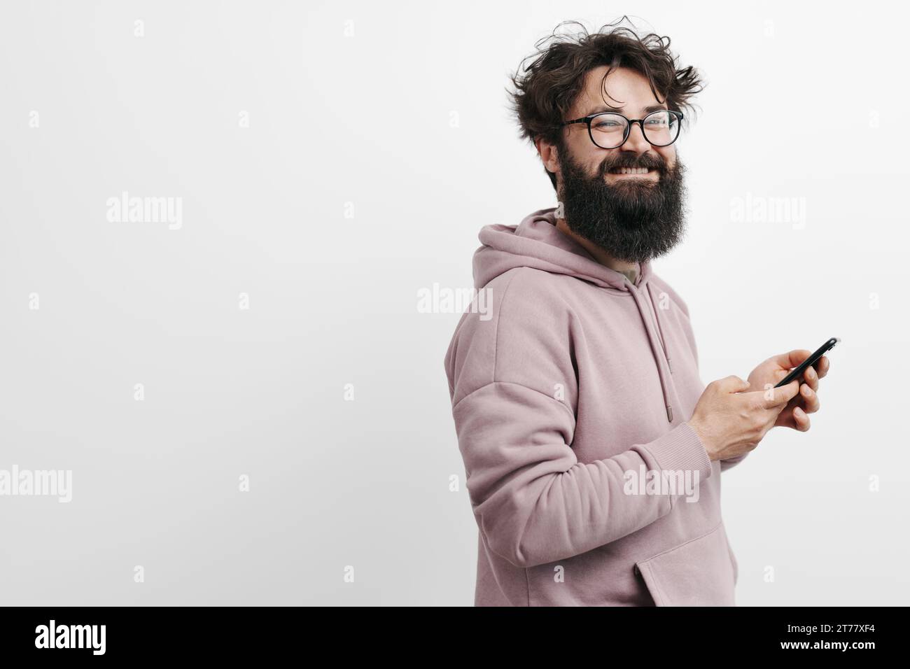 Happy Man Texting on Smartphone Stock Photo - Alamy