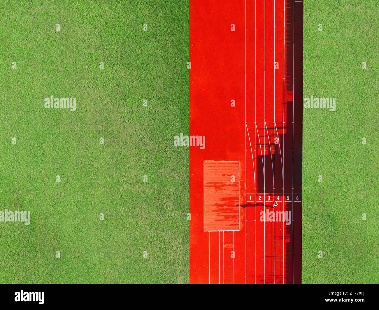 Aerial view of a man running on a track field Stock Photo - Alamy