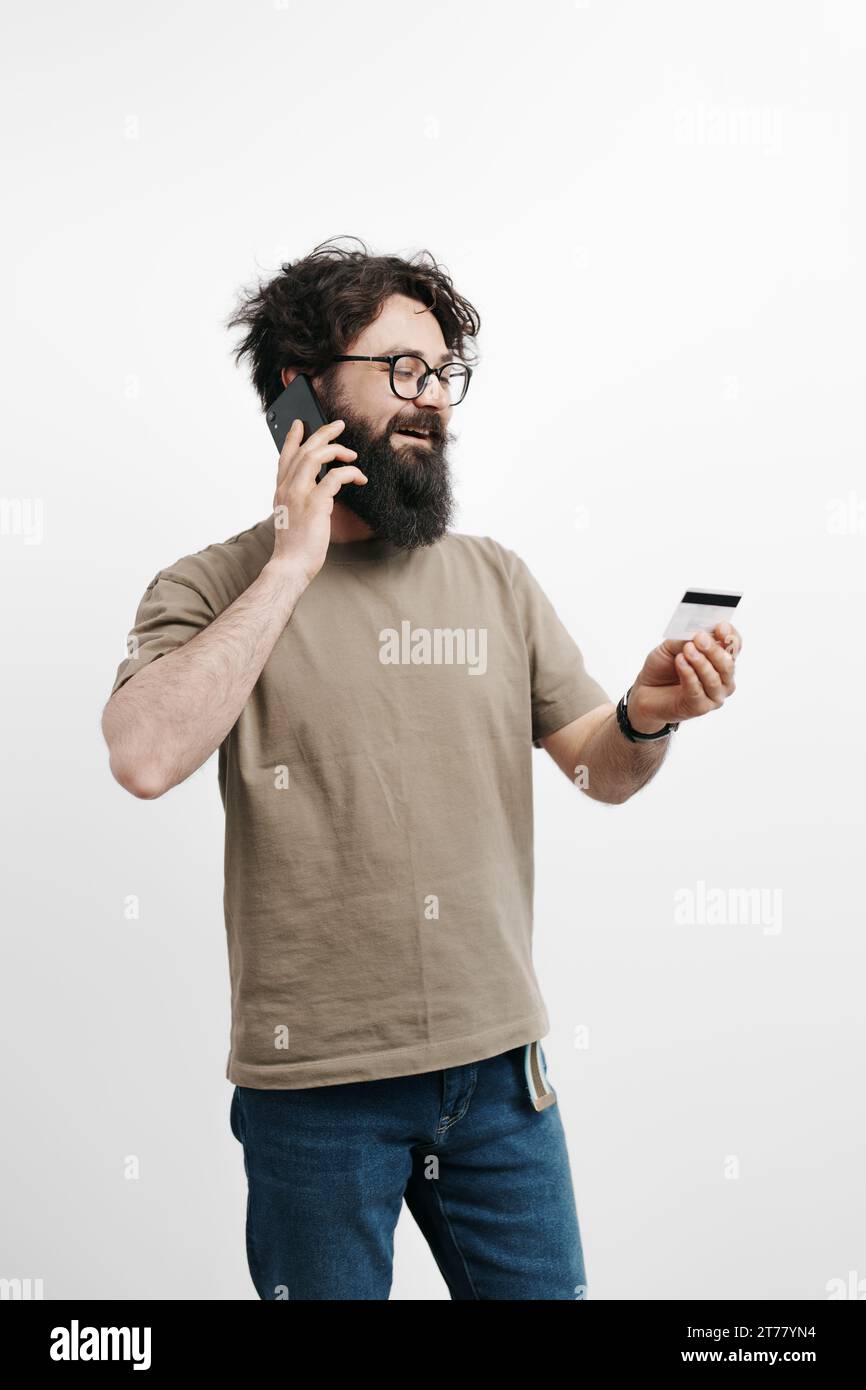 Man Multitasking with Phone Call and Credit Card Stock Photo - Alamy