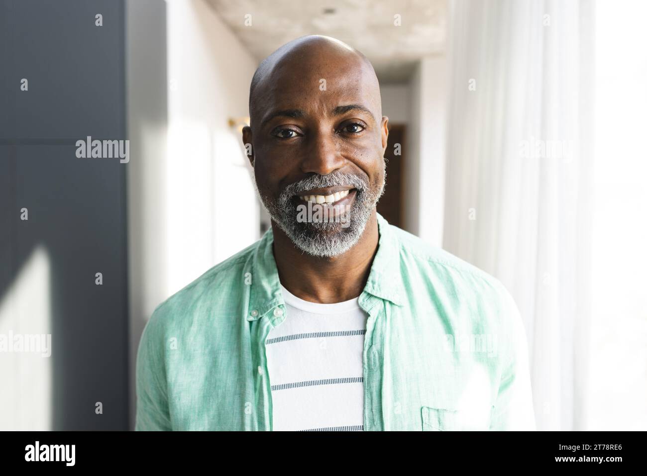 Portrait of happy bald african american mature man with beard smiling ...