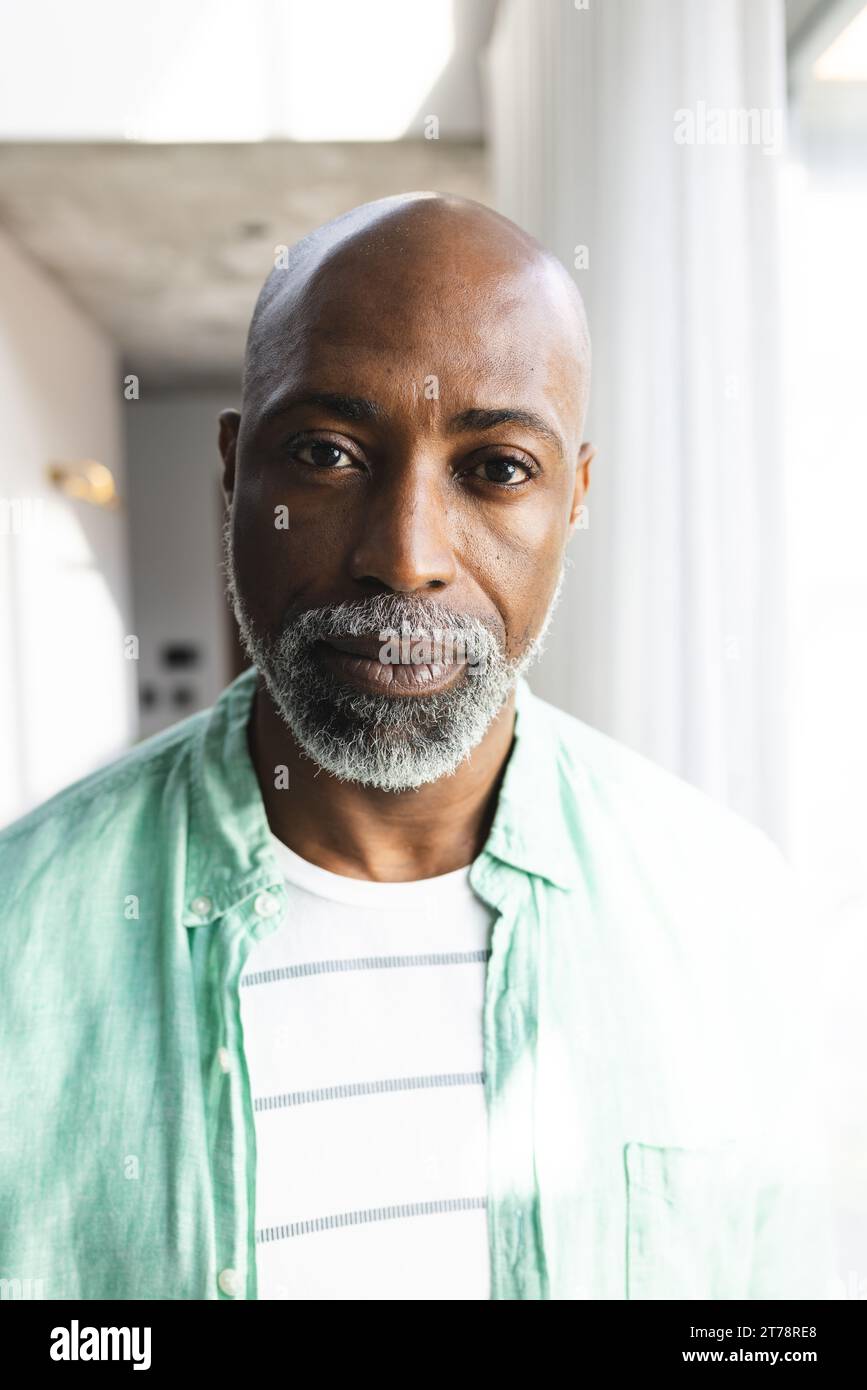 Portrait of thoughtful bald african american mature man with beard in ...