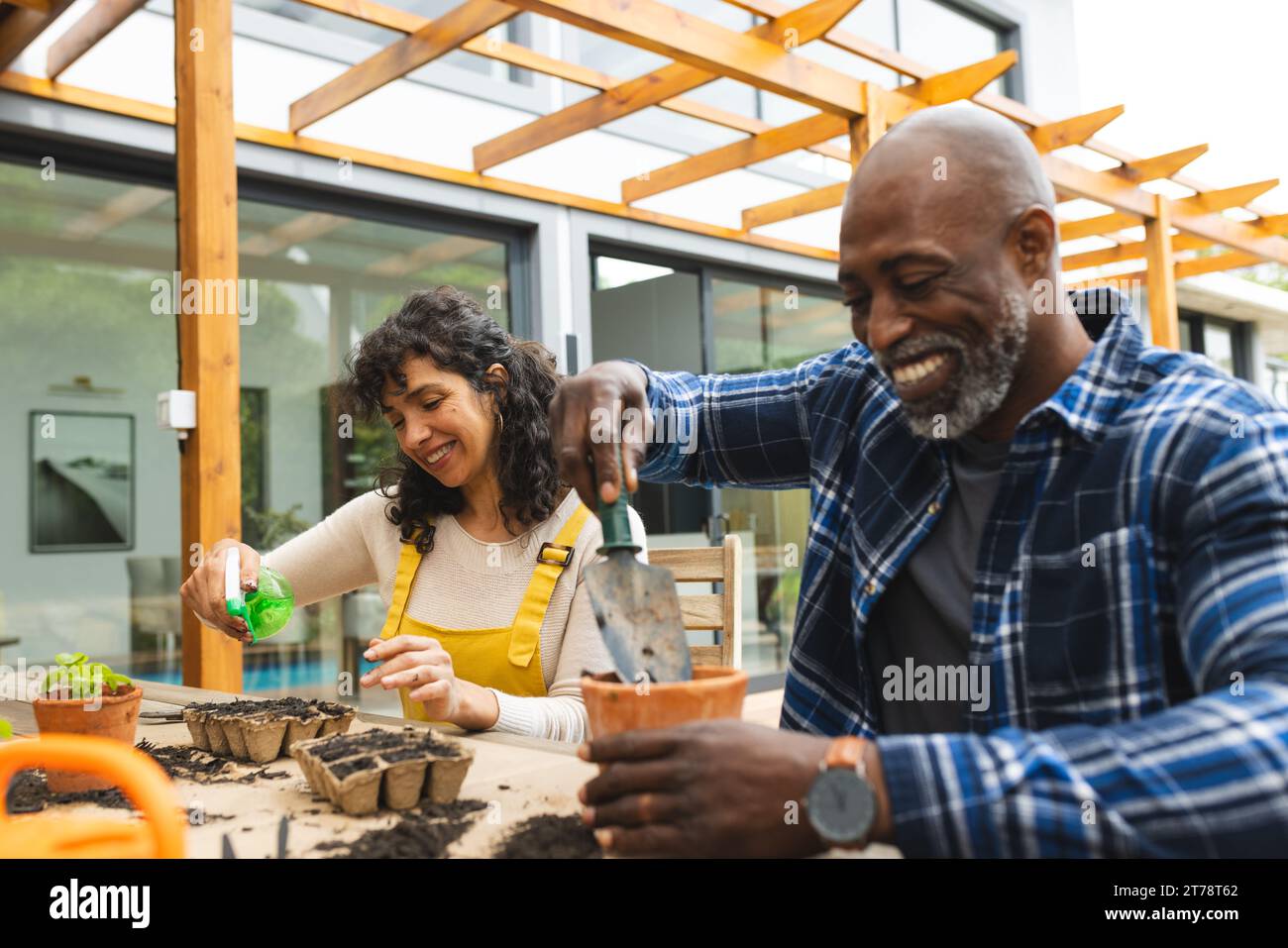 Happy diverse mature couple potting hi-res stock photography and images ...