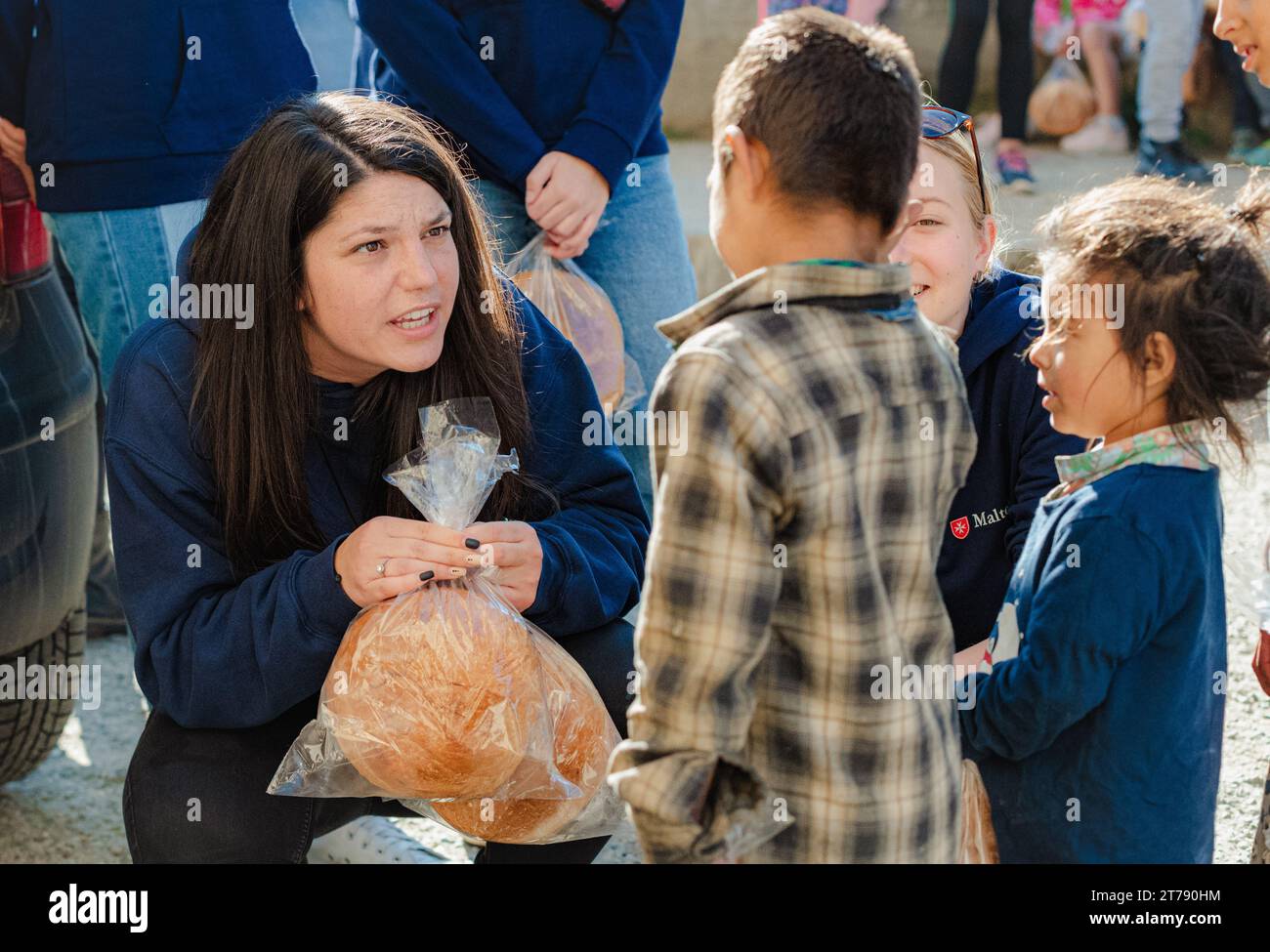The poor gypsy kids getting bread from volunteers Stock Photo - Alamy