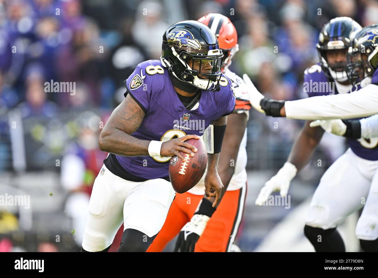 Baltimore Ravens quarterback Lamar Jackson (8) scrambles as he looks to ...