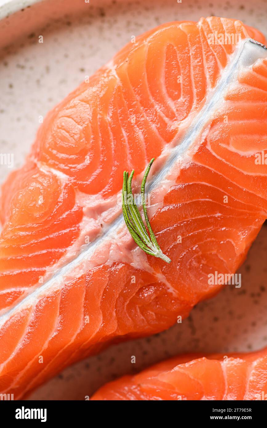 raw salmon medallions with lemon Stock Photo - Alamy