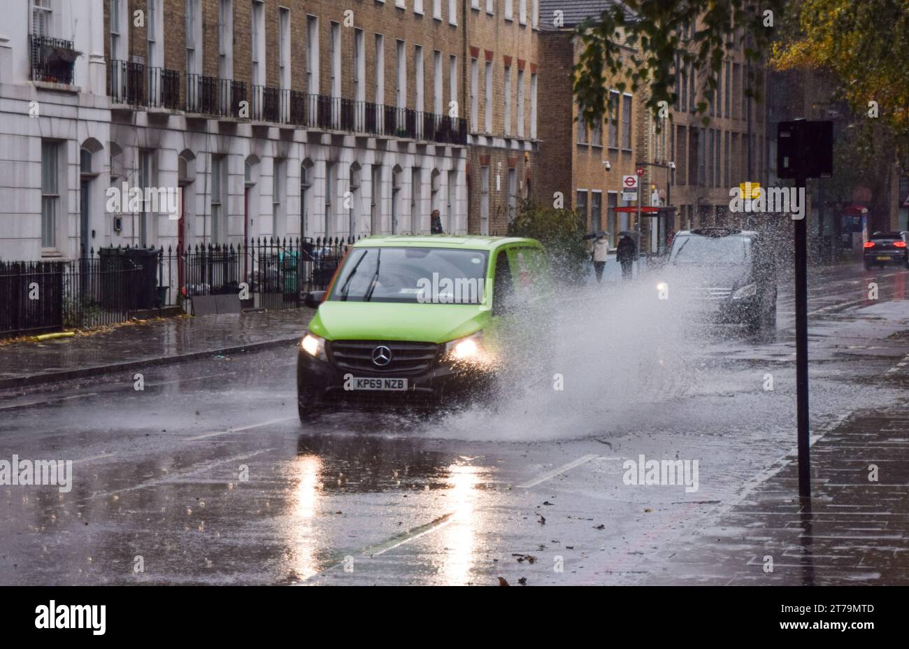 London, England, UK. 14th Nov, 2023. A van splashes through a large ...