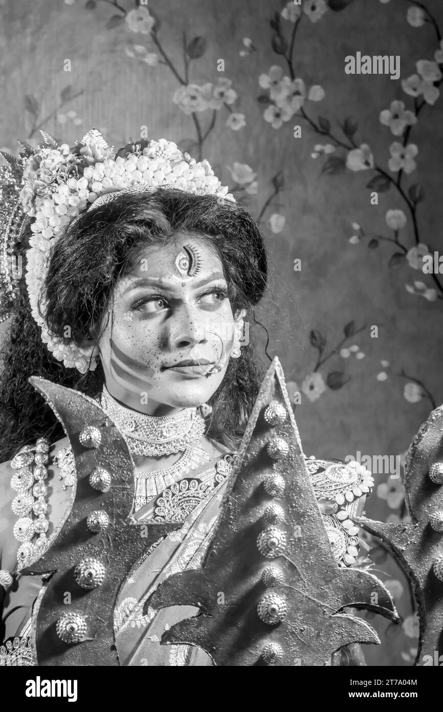 Portrait of beautiful Indian girl of Durga Idol Agomoni Concept Indoor ...