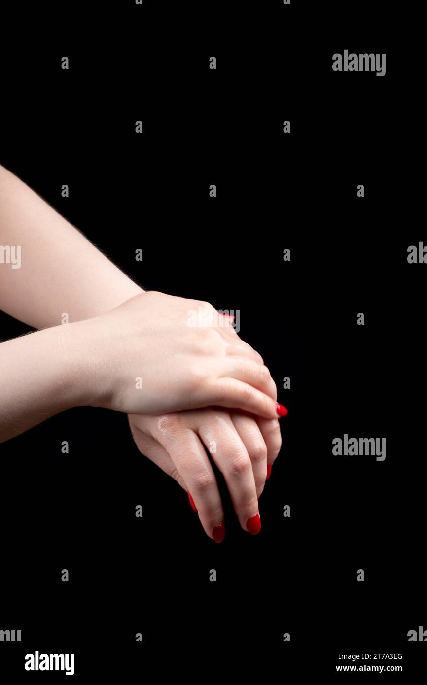 Women's hands rub disinfectant gel over their palms. Health concept ...