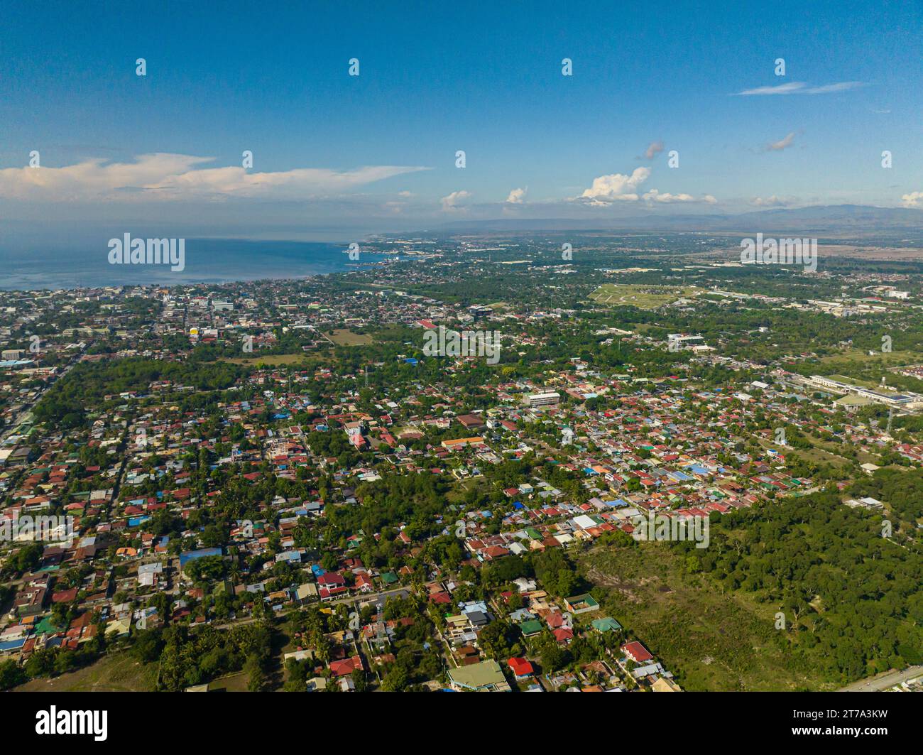 Beautiful landscape of highly urbanized city. General Santos under blue sky and clouds. Mindanao ...