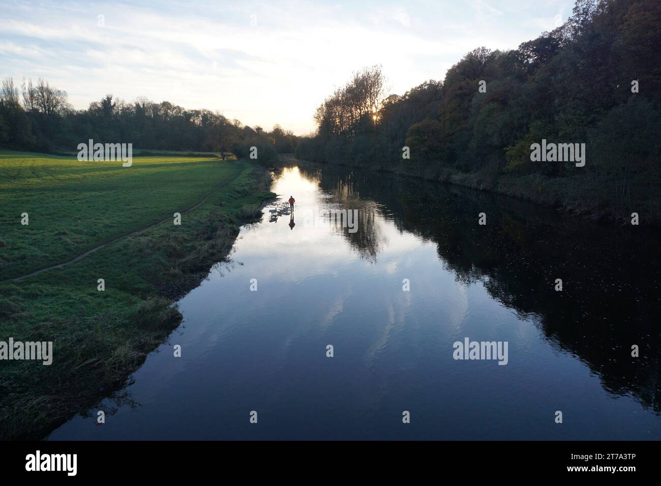 Reflections on river late afternoon Stock Photo - Alamy