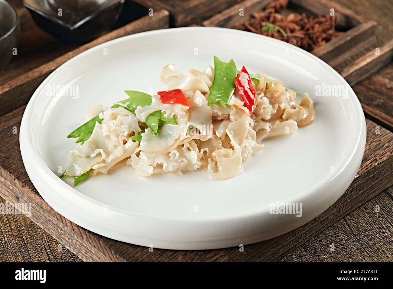 stir-fried slices sea snails or Conch Stock Photo - Alamy