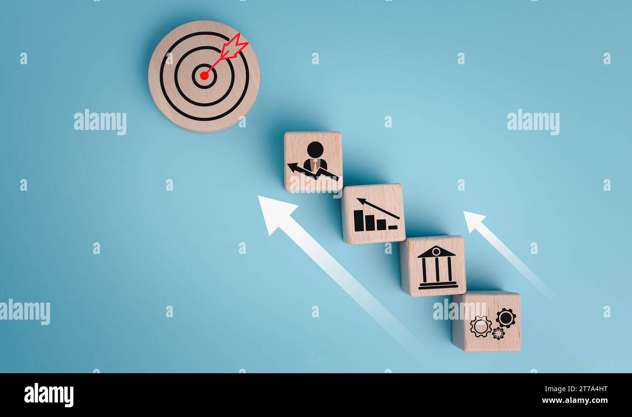 Circular wood with printed target icons and business symbols on white ...