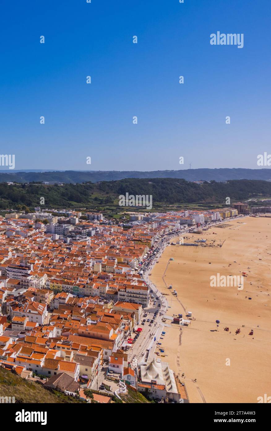 A coastal town with colorful terracotta rooftops and a tranquil azure ...